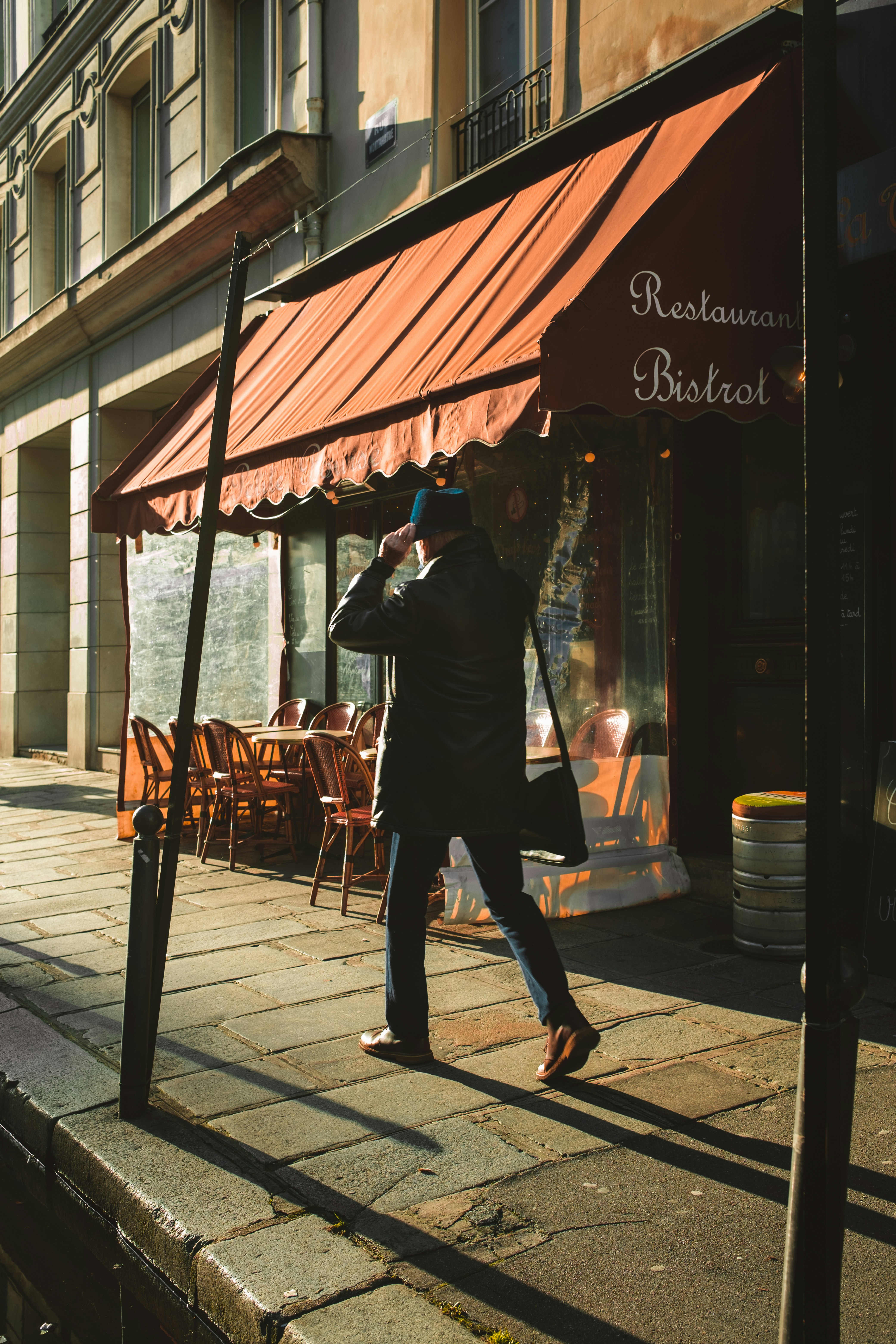 Footsteps in the Sunlit Café Alley