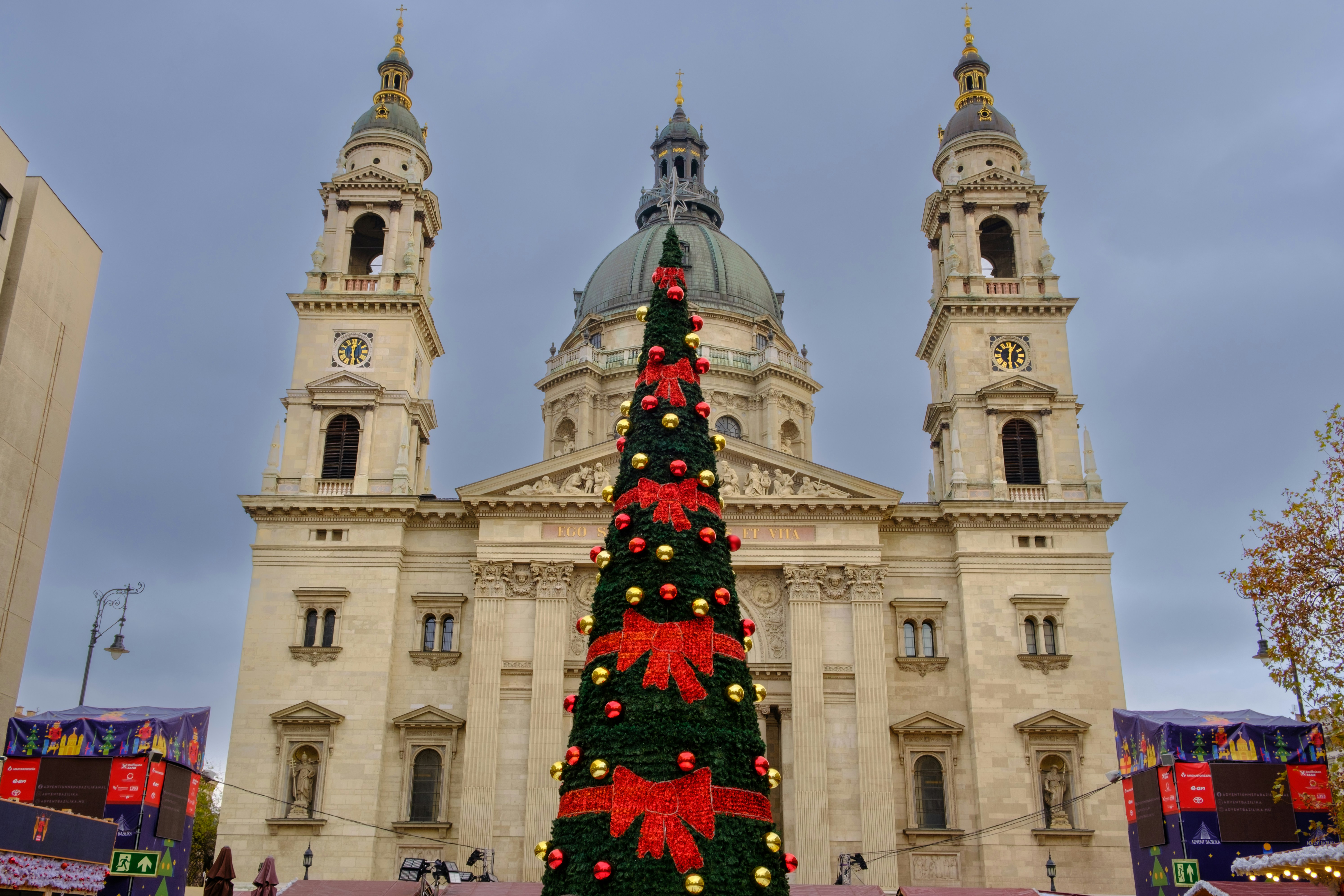 Symmetry Under Ornament: Christmas Tree Framing a Grand Cathedral
