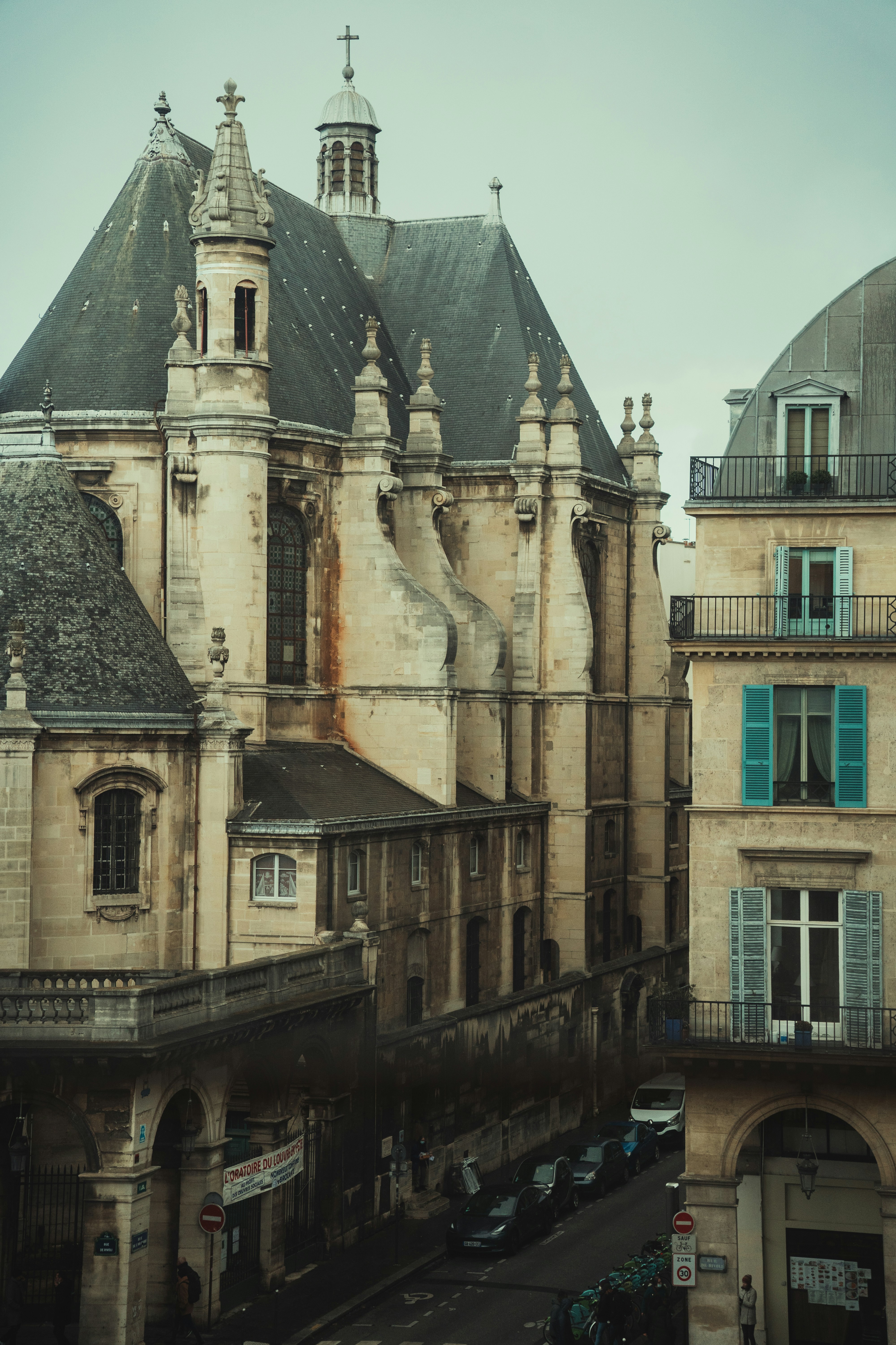 A large building with many windows and a clock tower photo – Free ...