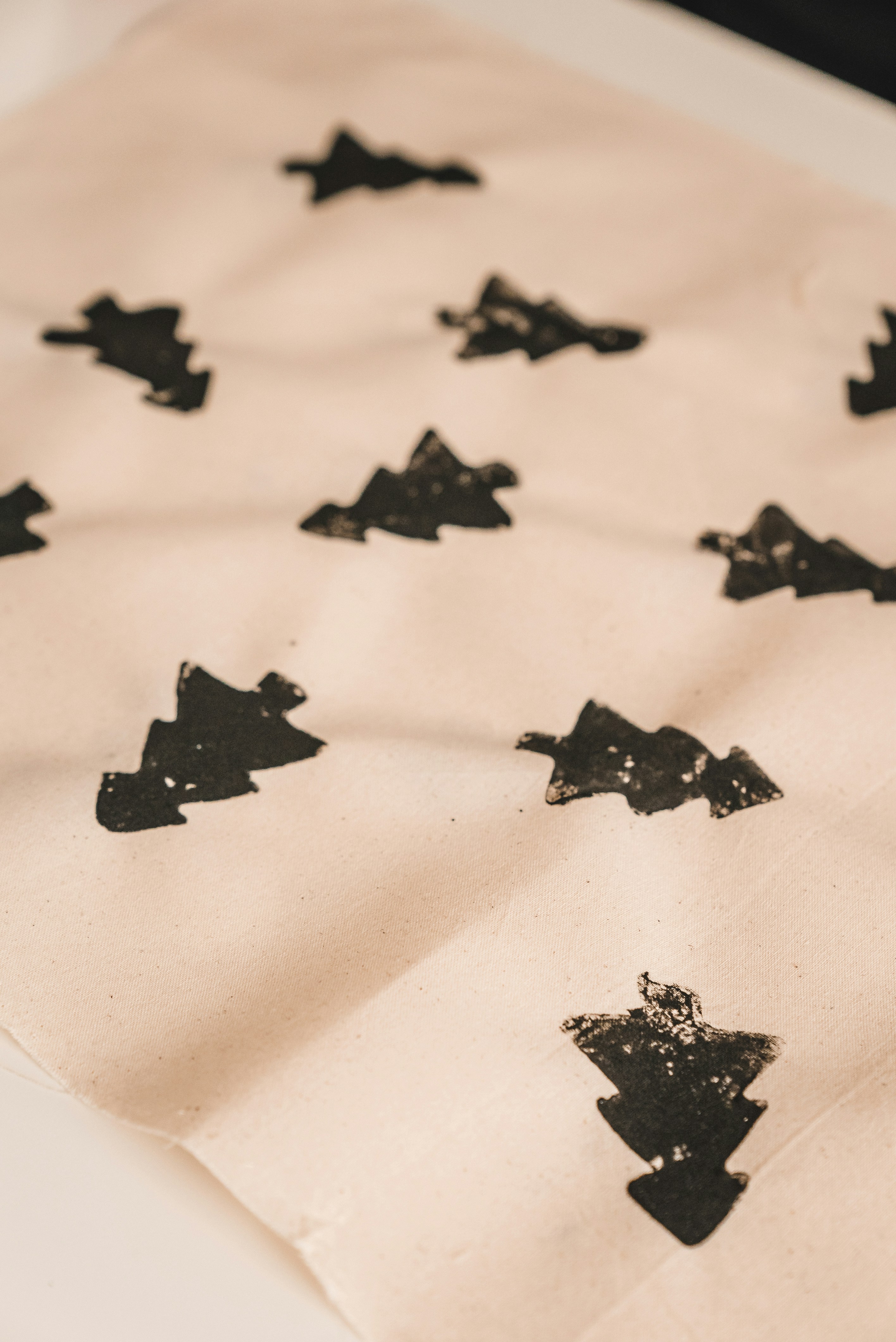 Fleet of Paper Silhouettes on a Crumpled Canvas
