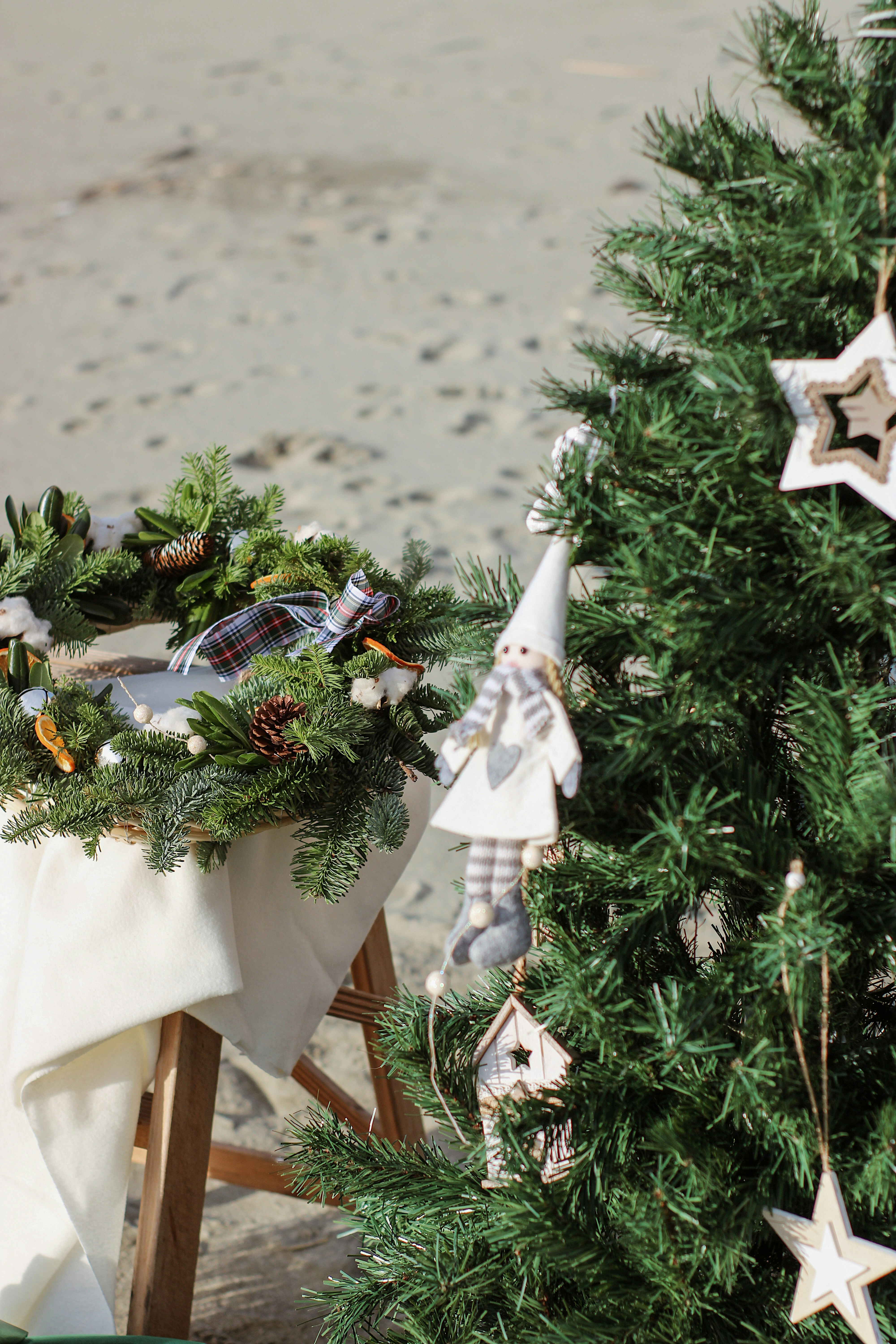 Winter Tableaux: Greenery, Pinecones, and Delicate Ornaments Draped by a Christmas Tree
