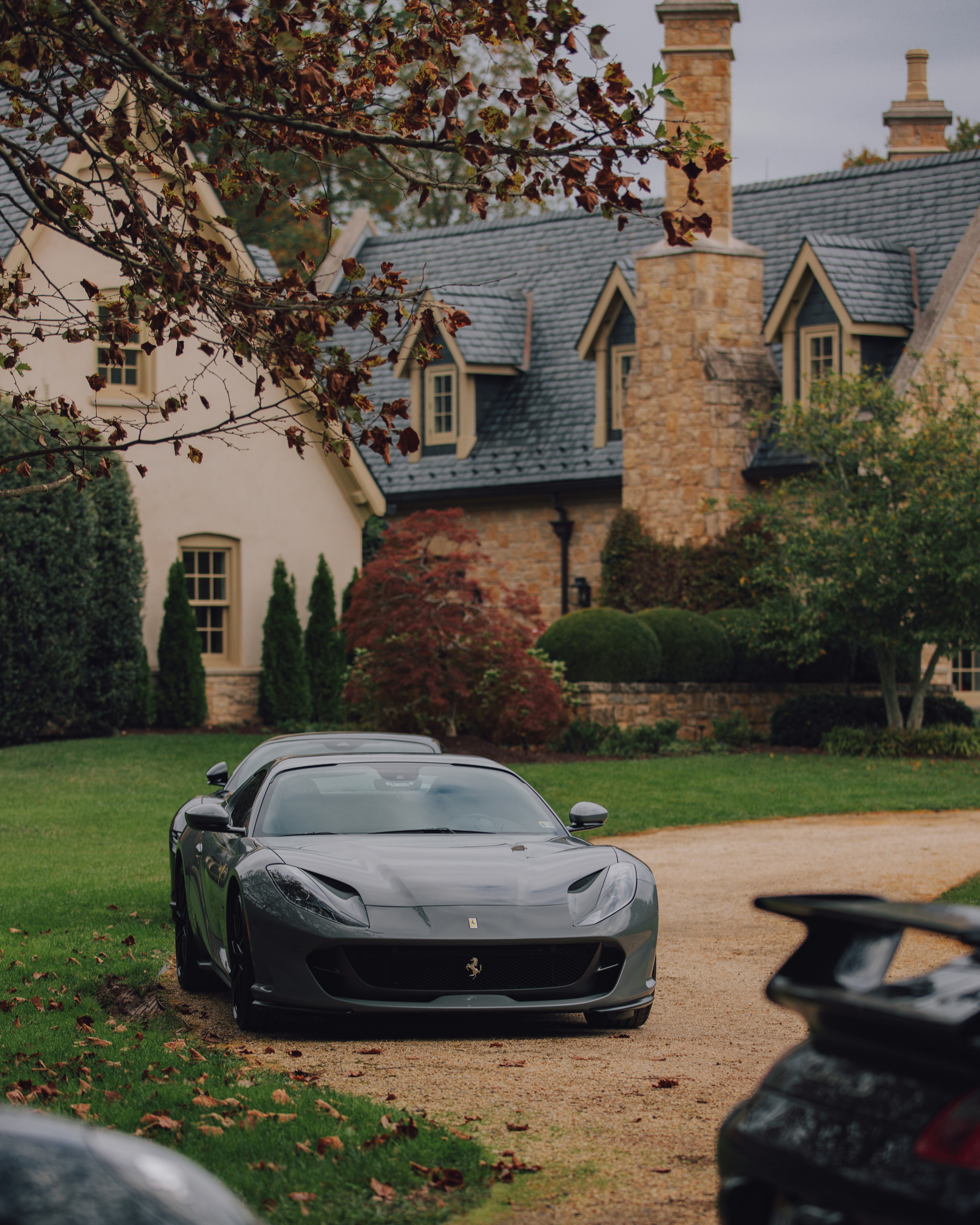 Grey Ferrari in the Driveway of a Tudor-Style Estate