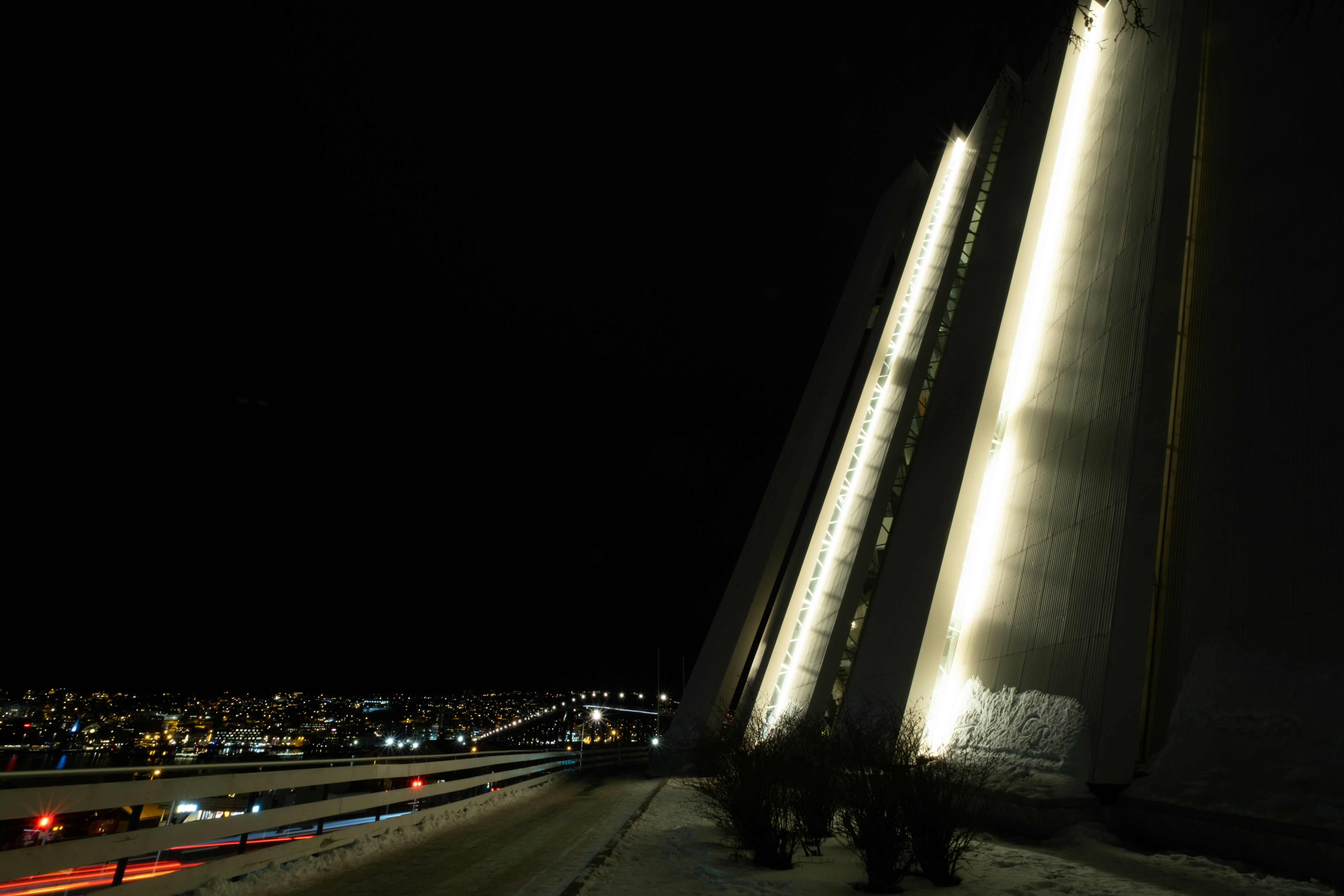 Pylons in Light: Nightfall over a Snowbound Bridge