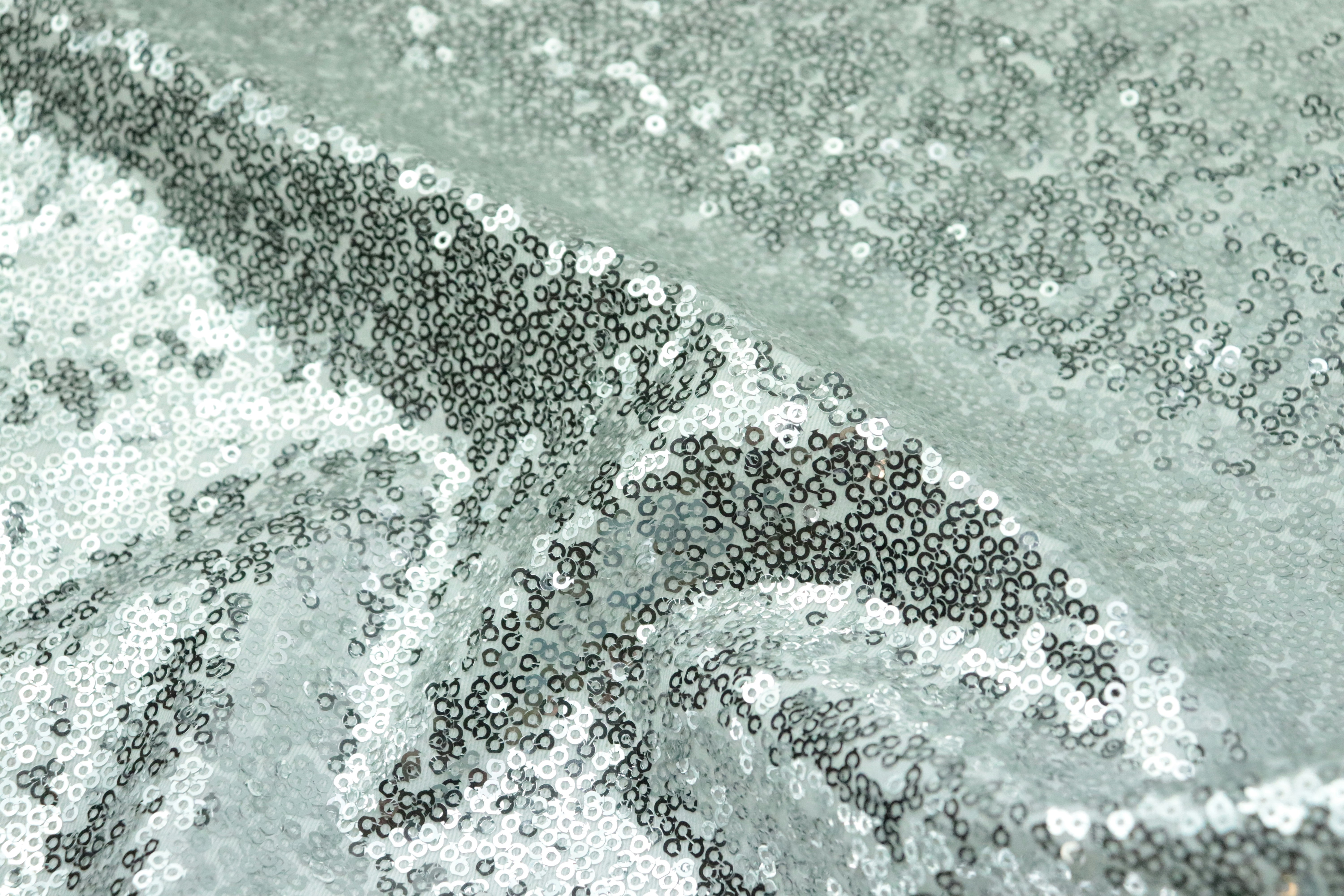A close up of a silver sequin fabric photo – Free Nature Image on Unsplash