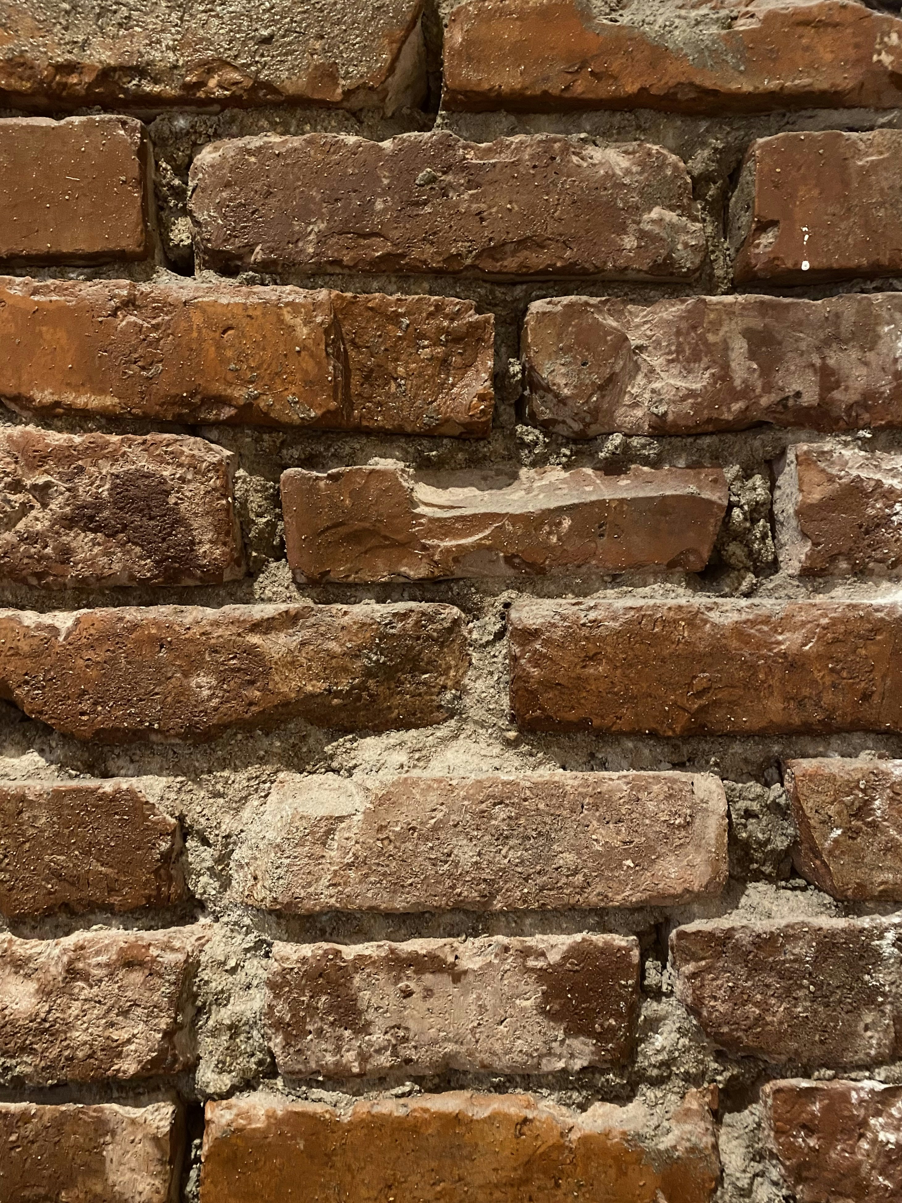 A close up of a brick wall made of bricks photo – Free Wallpaper Image ...