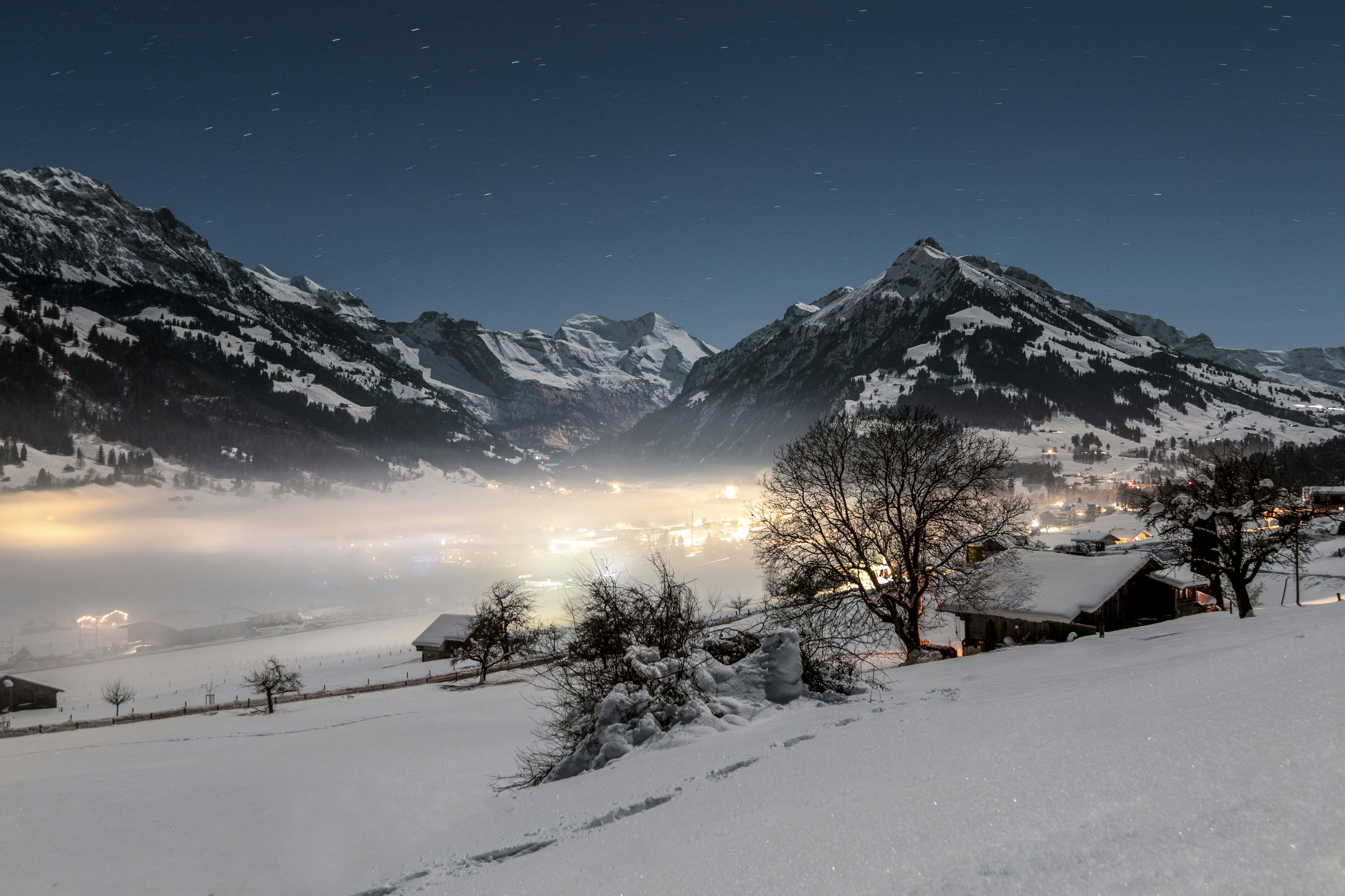 Starlit Valleys Over Snowbound Peaks: A Quiet Alpine Night