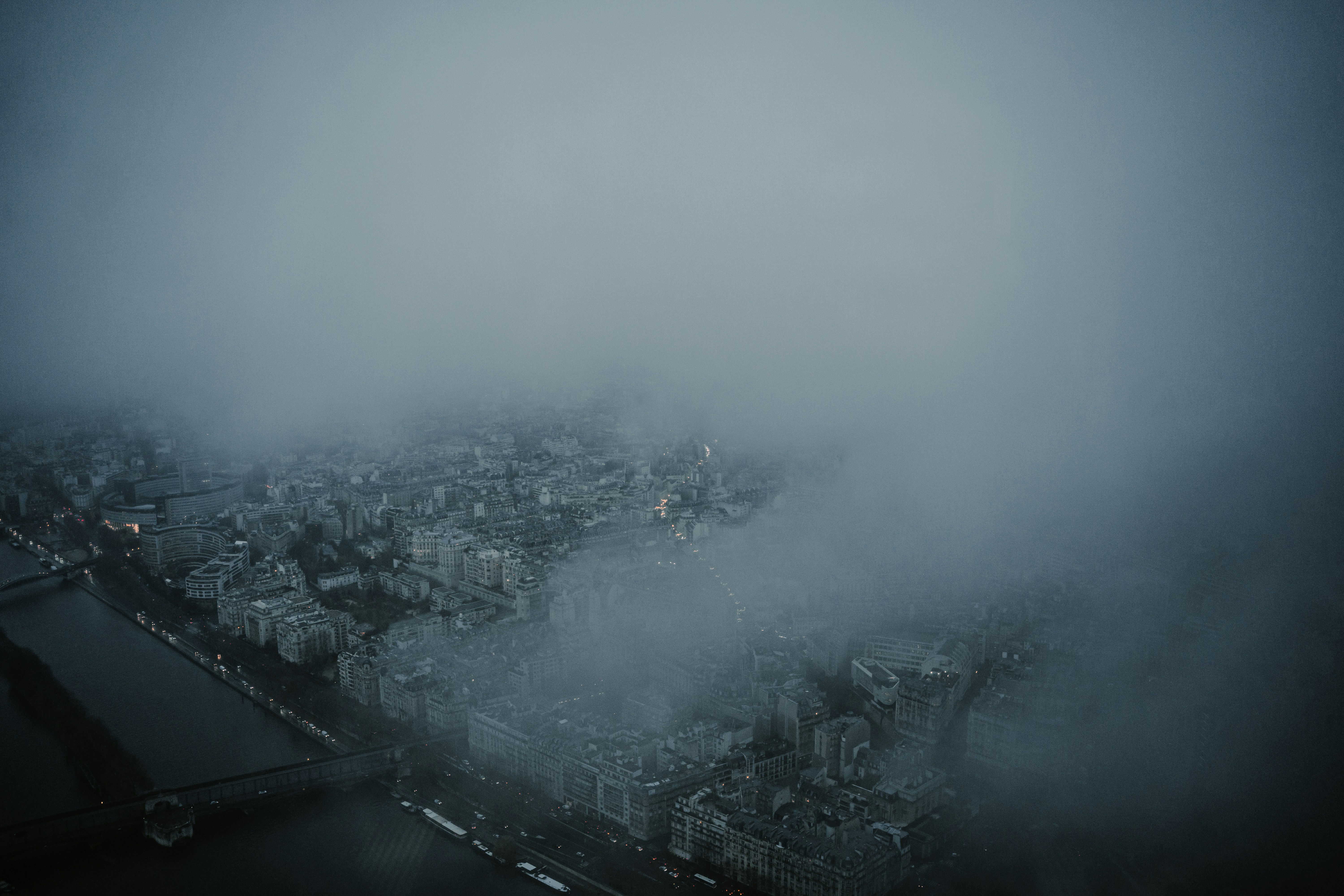 An aerial view of a city in the fog photo – Free Paris Image on Unsplash