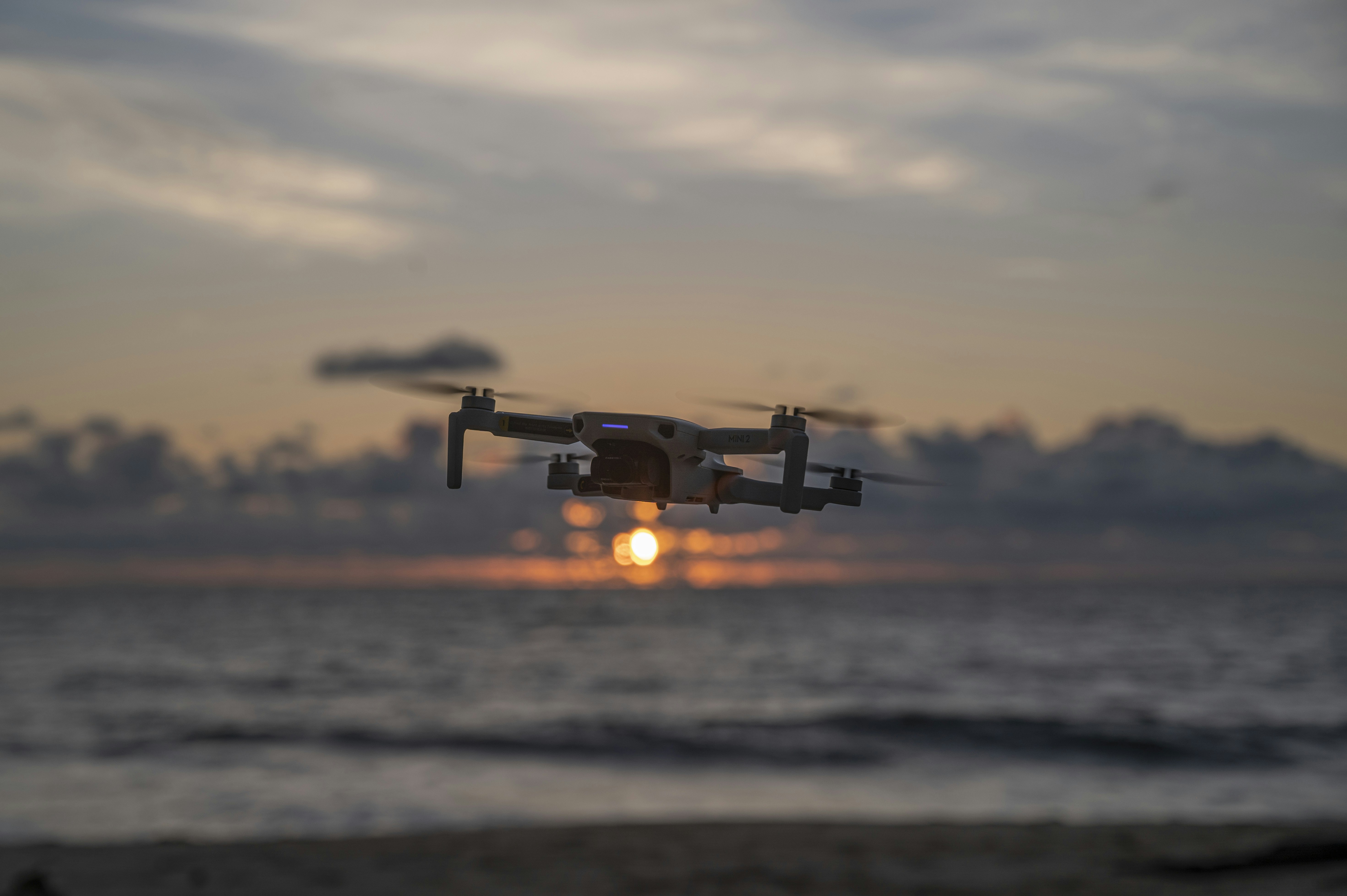 A small plane flying over the ocean at sunset photo – Free Mararikulam ...