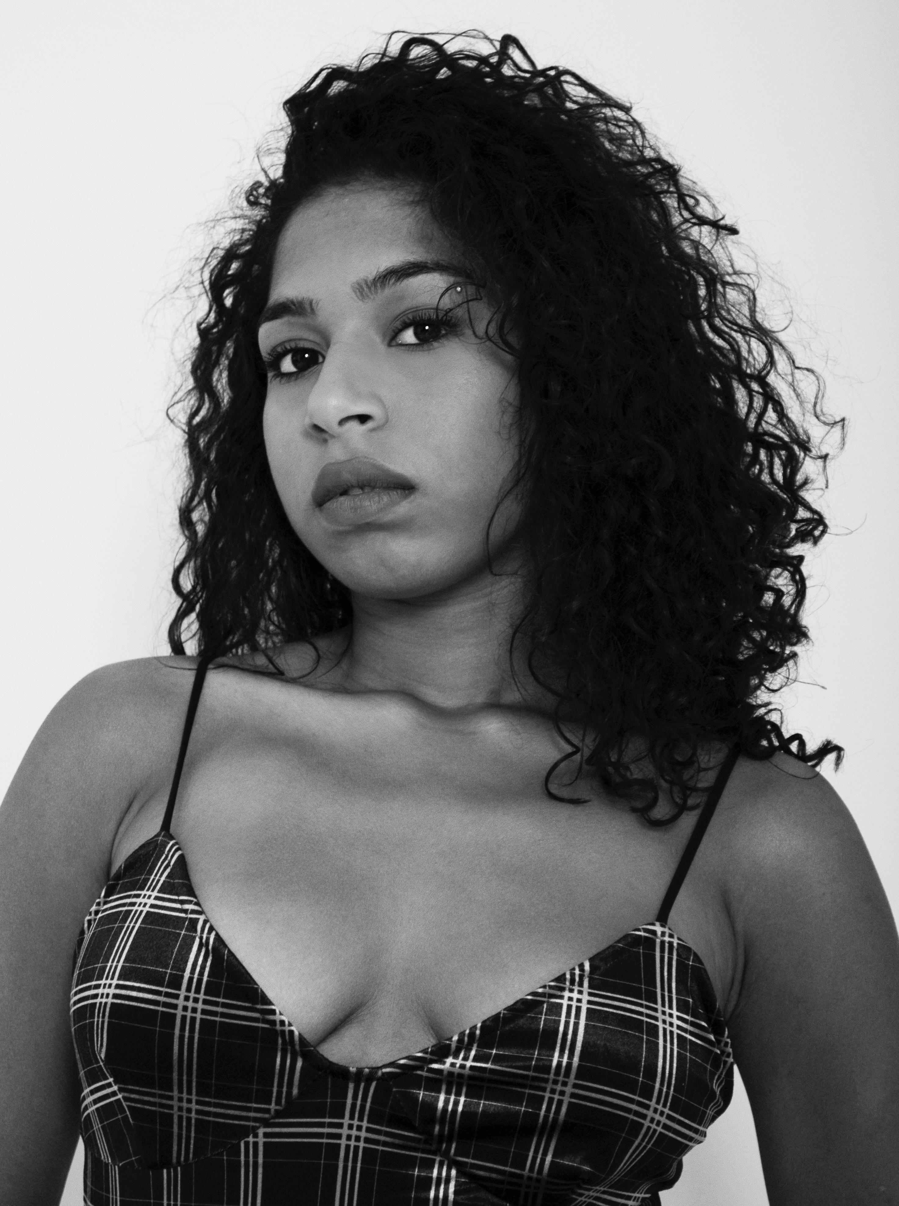 A black and white photo of a woman with curly hair photo – Free Girl ...