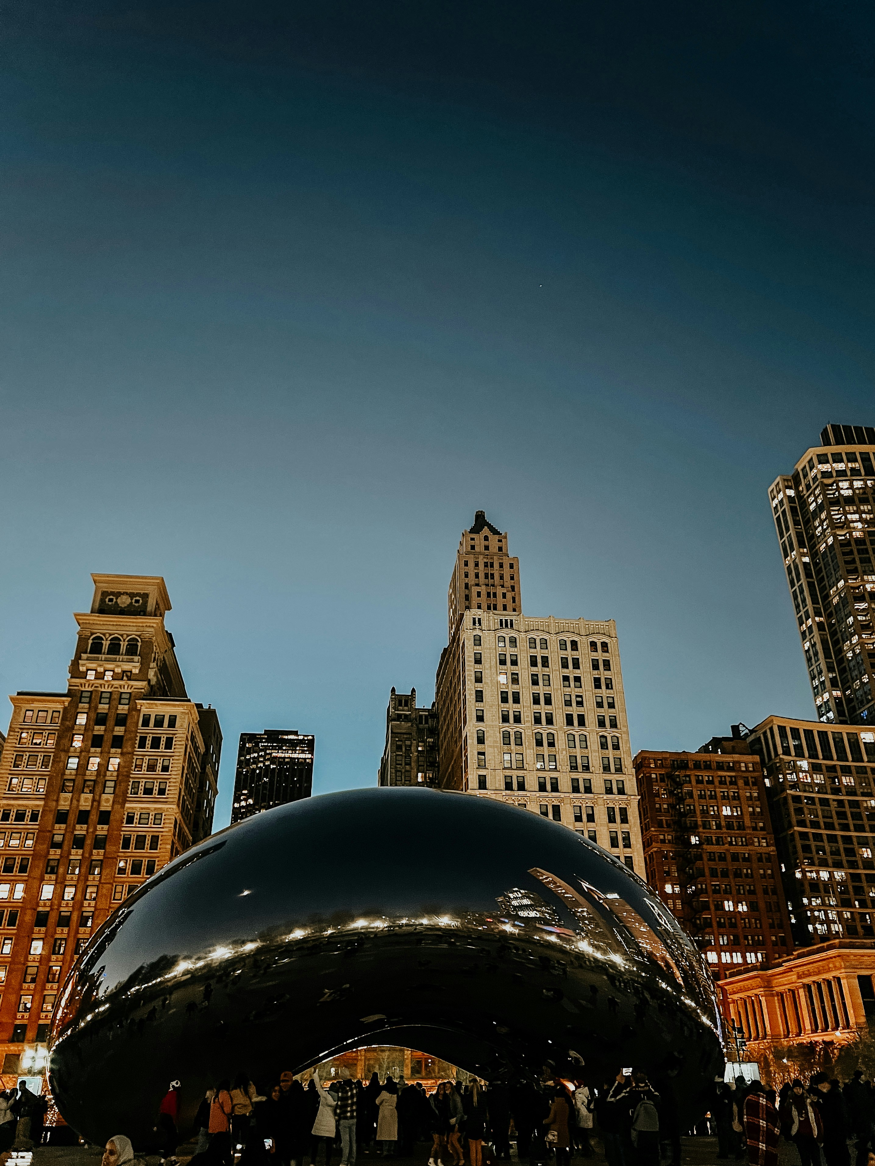 City Reflections: The Bean Among Skyscrapers at Dusk