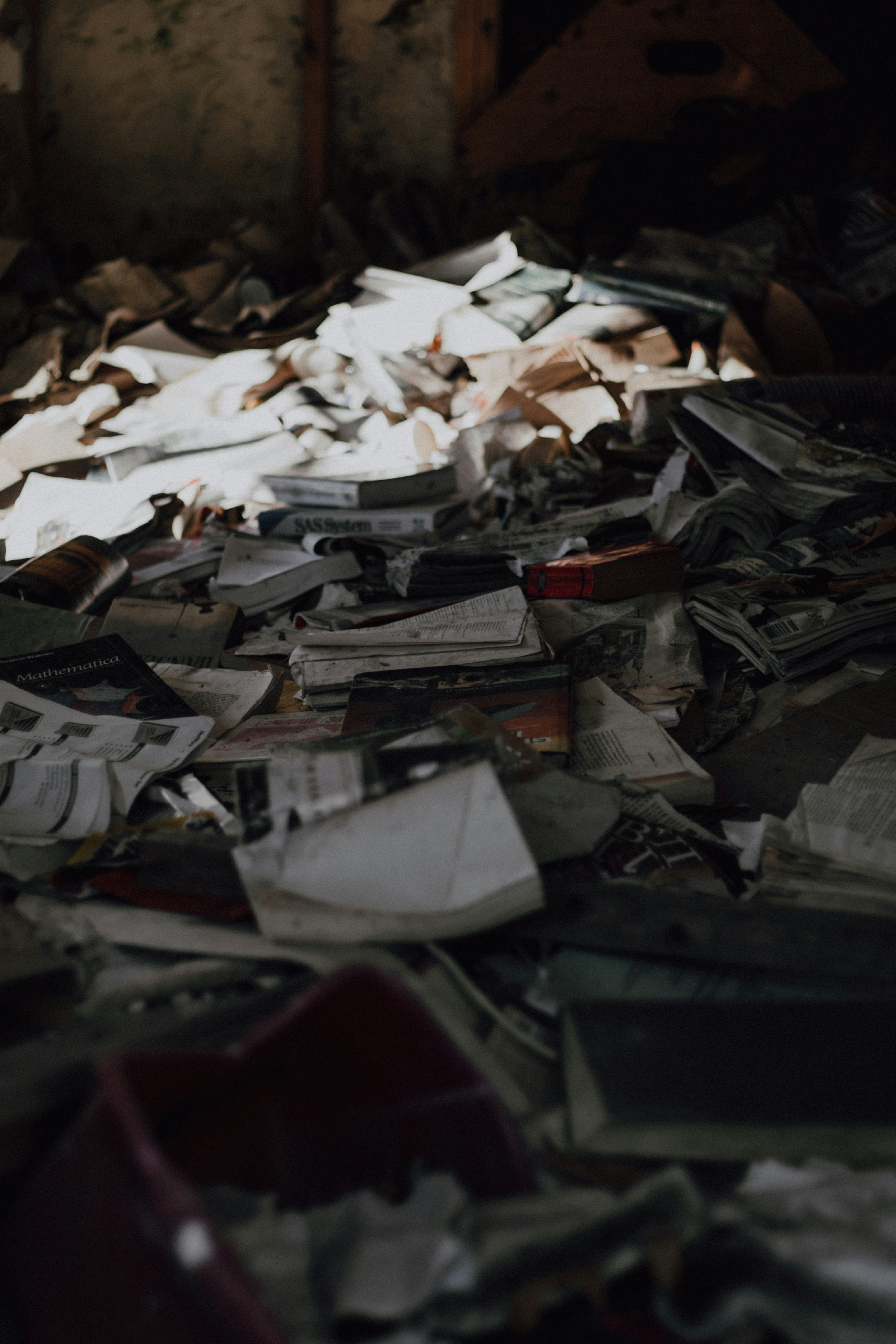 A pile of papers sitting on top of a floor photo – Free Filth Image on ...