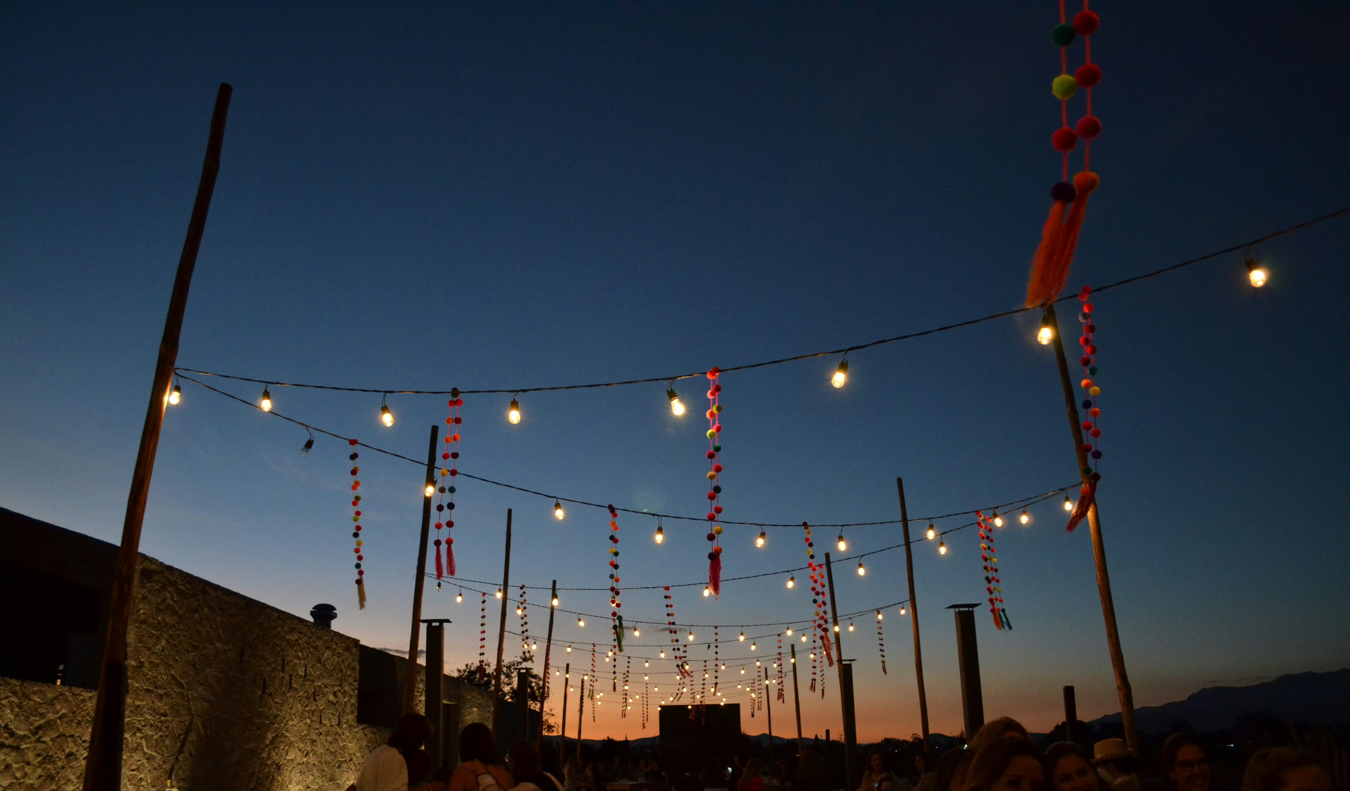 Dusk Lantern Corridor: Warm Lights Draped Over a Quiet Festival
