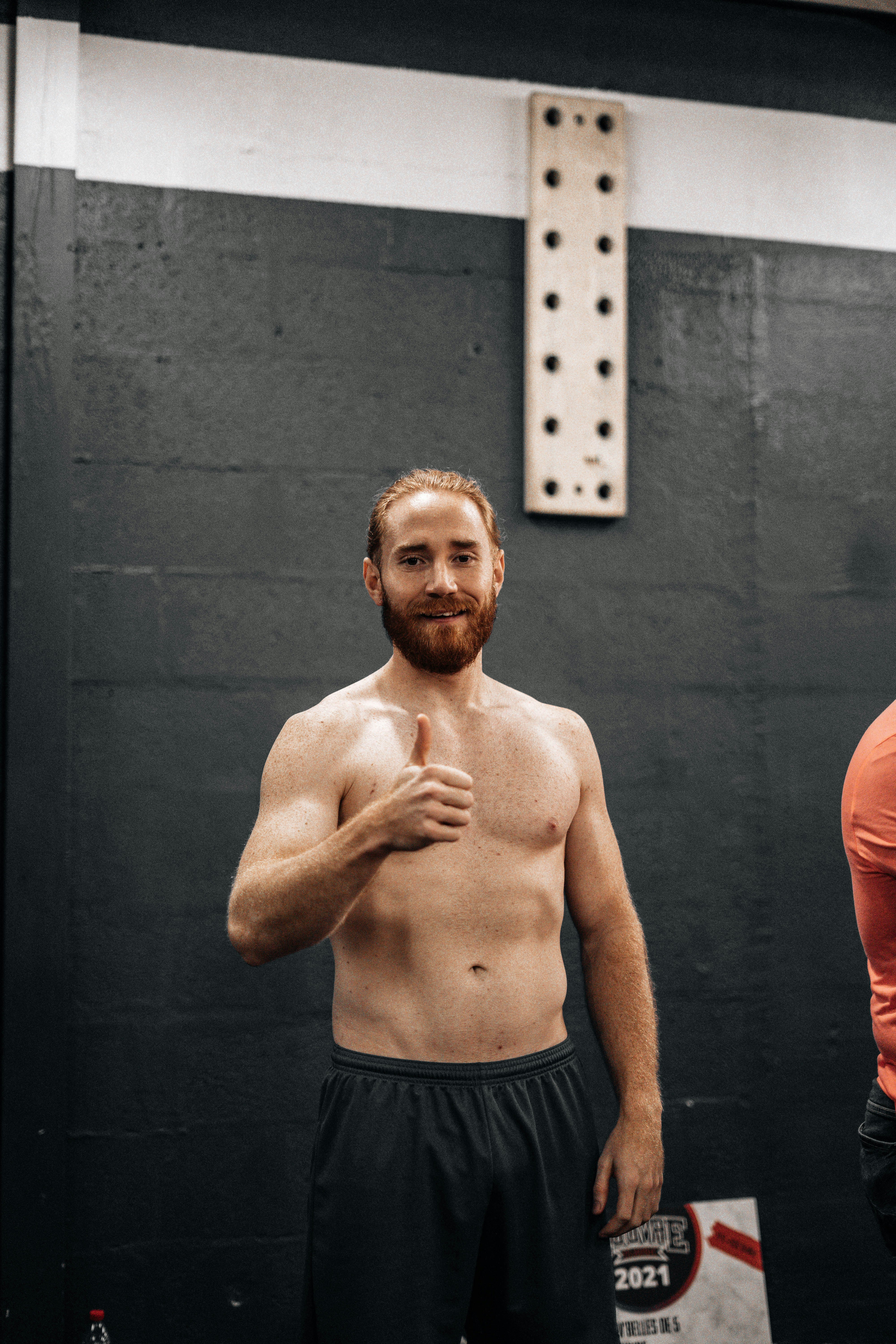 A man without a shirt standing in a gym photo – Free Man Image on Unsplash