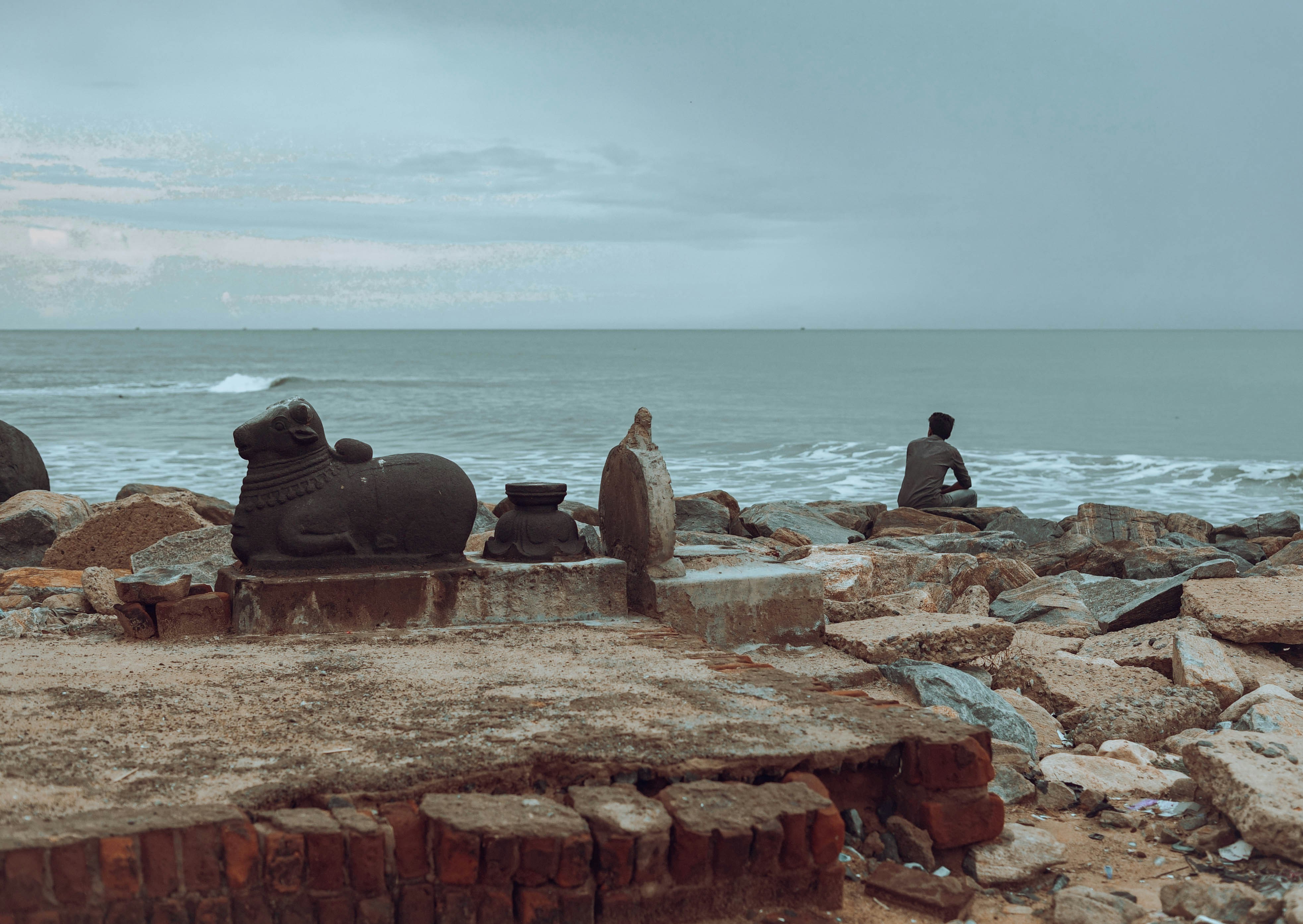 Sea Boulders and Quiet Watcher
