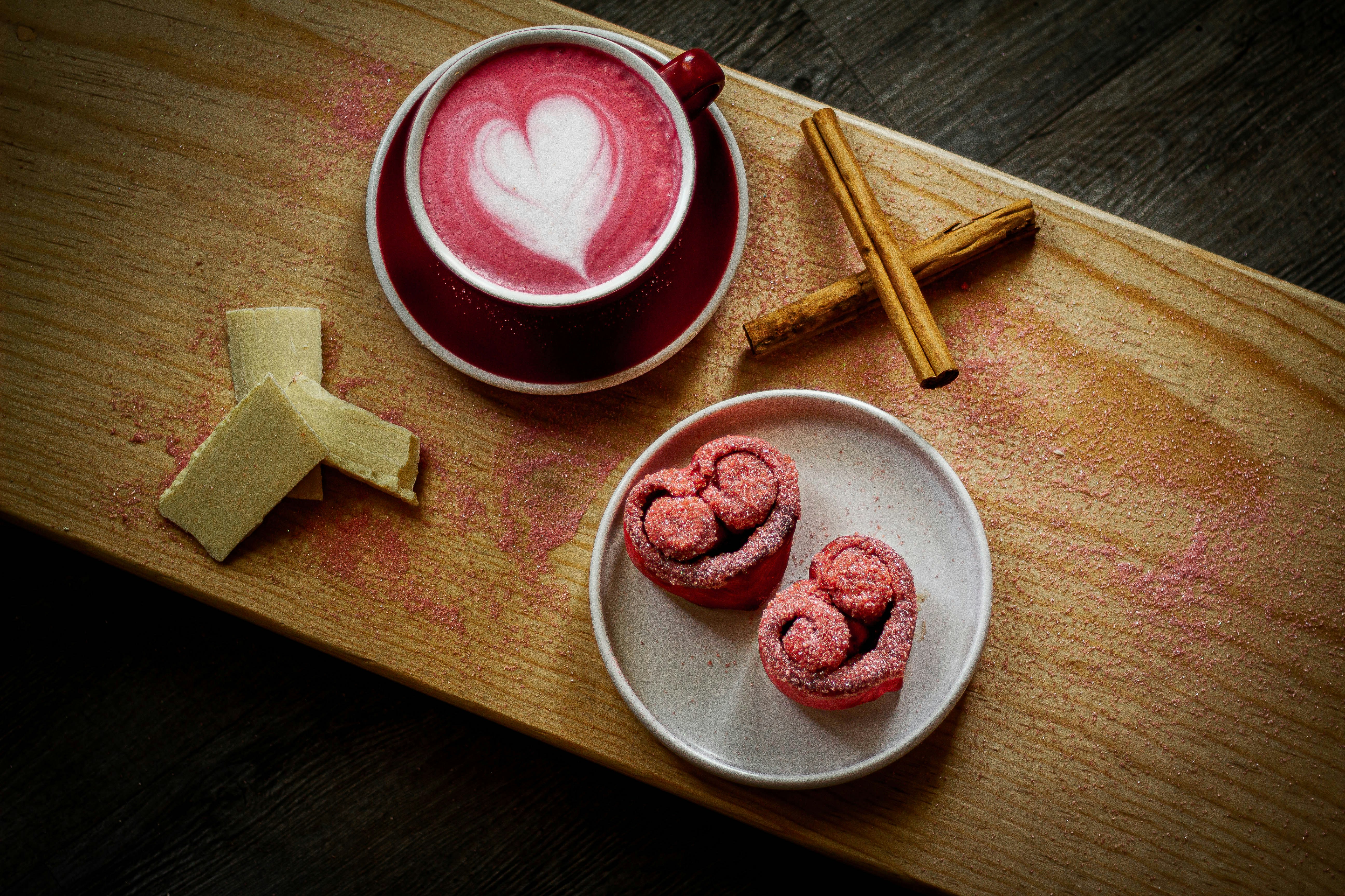 Heartfoam on a Rustic Board: Latte Art Meets Pink Pastries