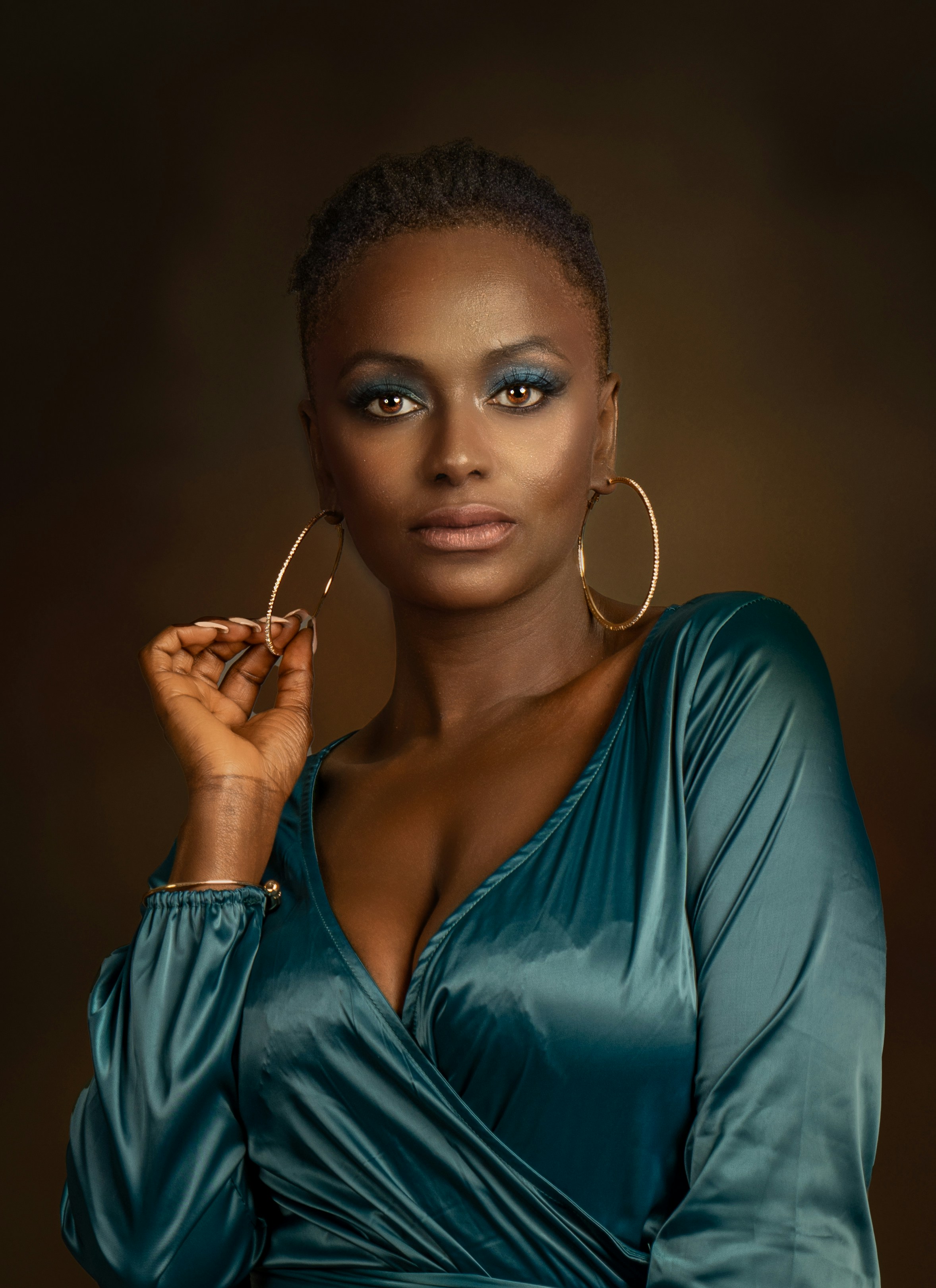 a woman in a blue dress posing for a picture