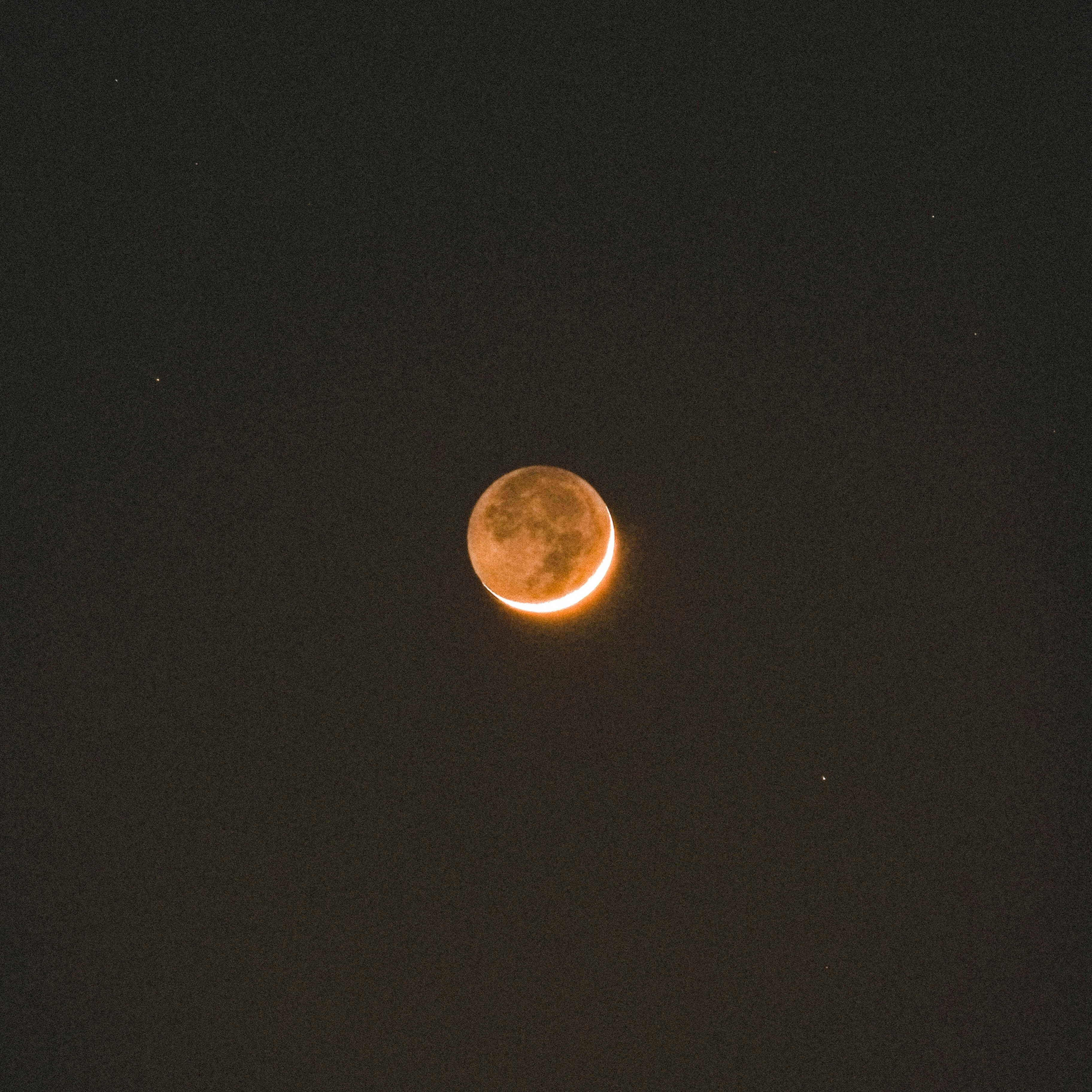 A bright orange moon is seen in the dark sky photo – Free Nature Image ...
