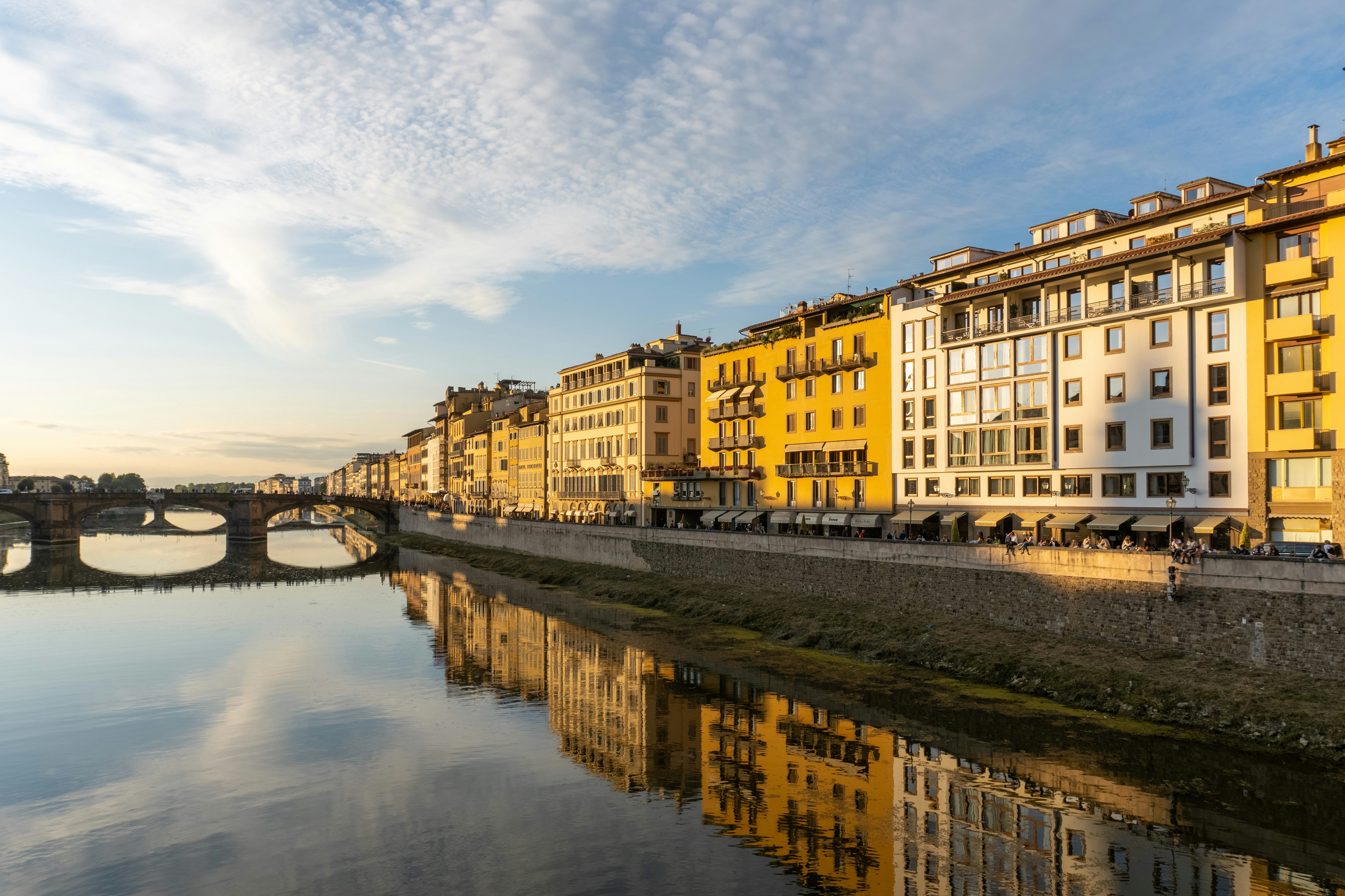A river running through a city next to tall buildings photo – Free ...
