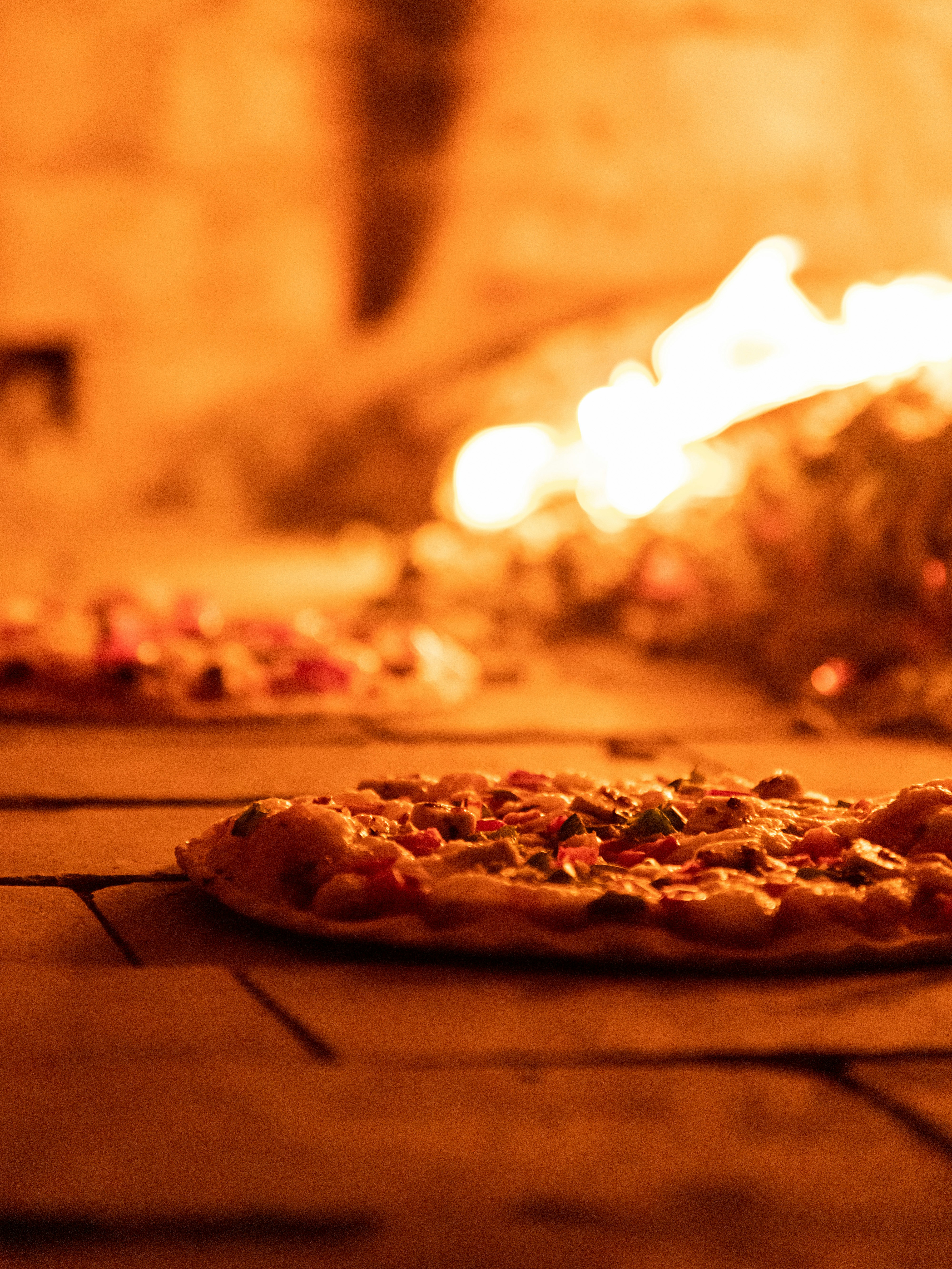 Amber Firelight on Pizza: Pizza Rounds on a Stone Patio