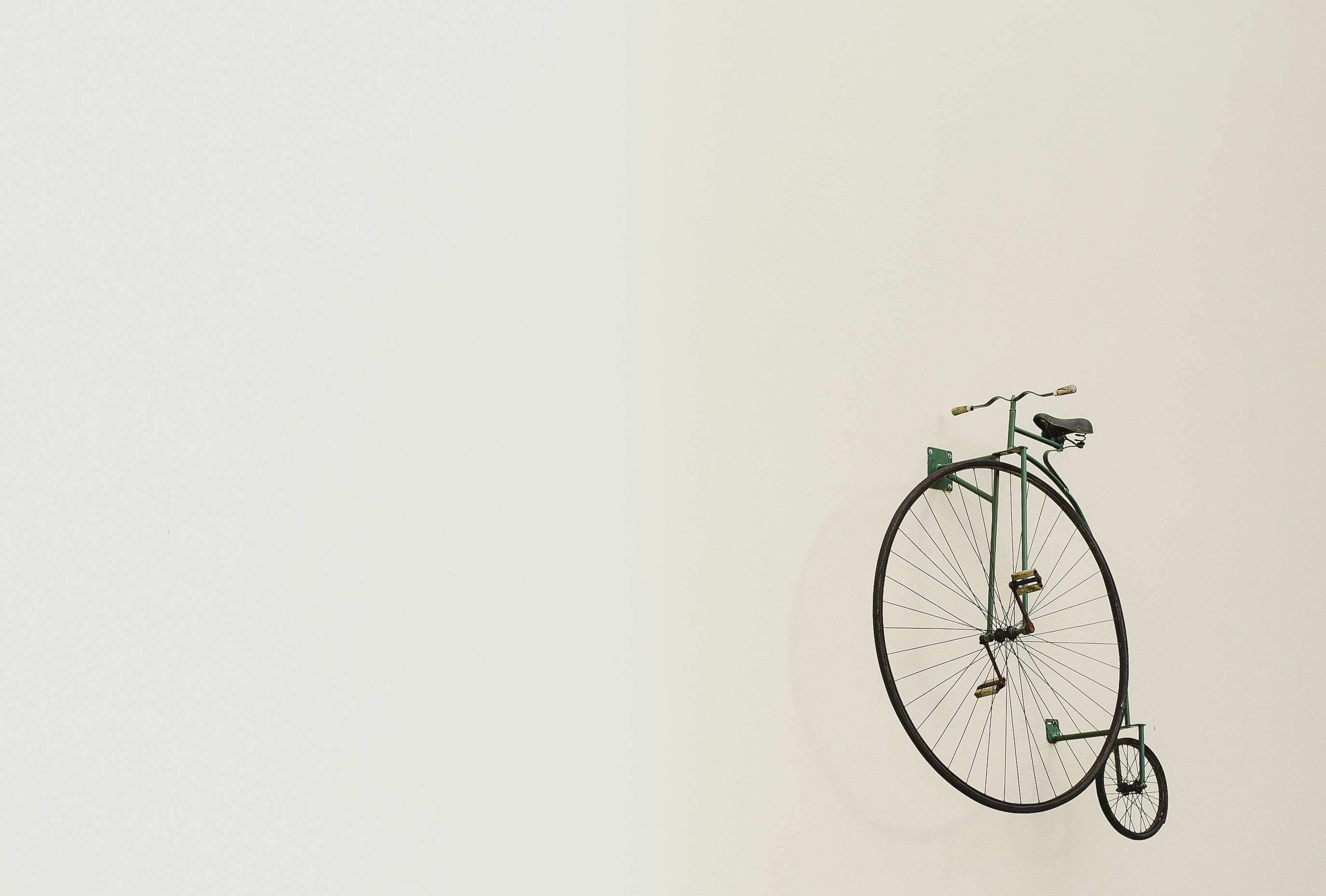 Echo of a Penny-Farthing on a Minimalist White Wall