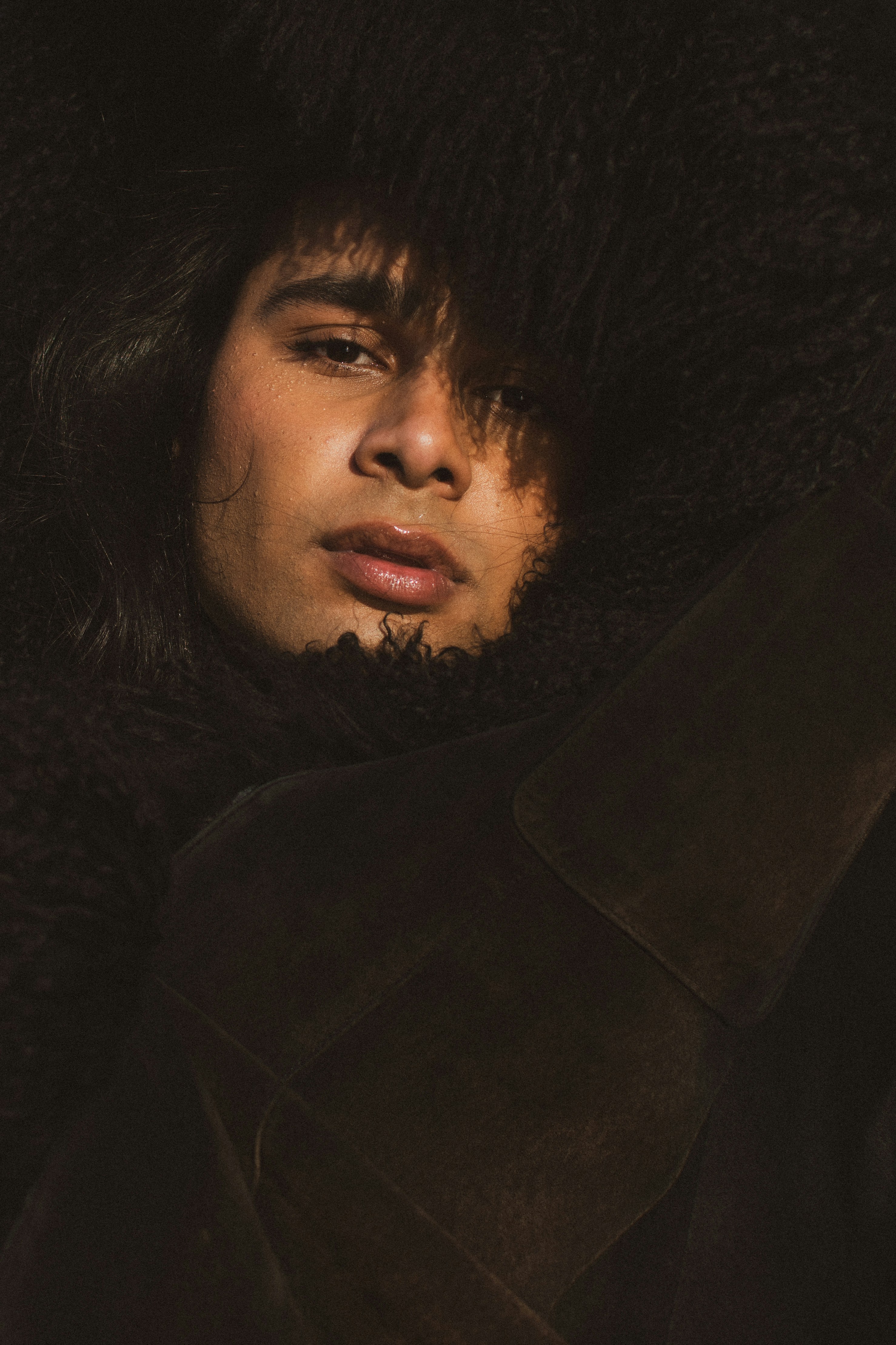 Glimmer in Velvet Shadow: A Quiet Portrait Wrapped in Warm Light