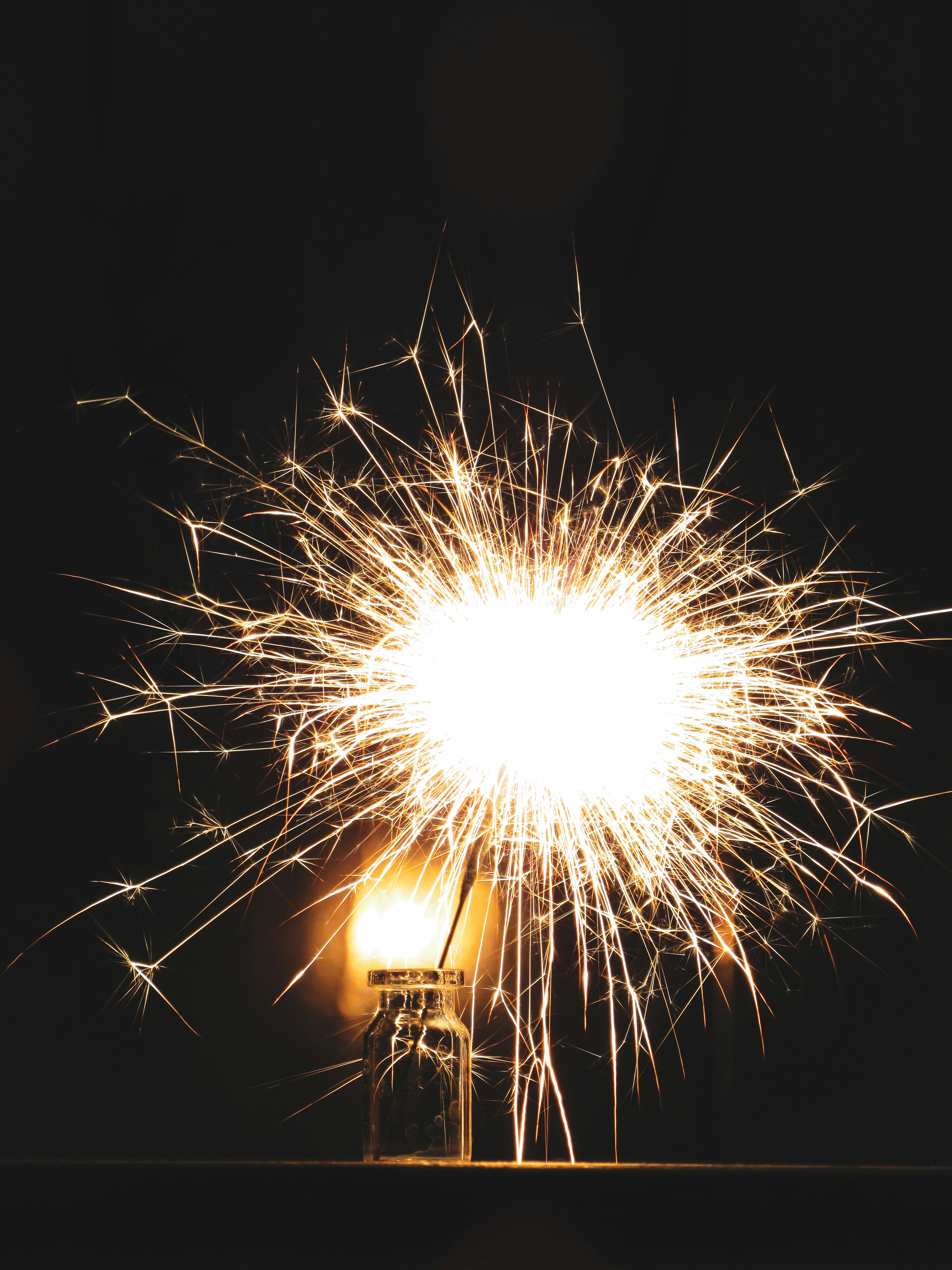 a firework is lit up in the night sky