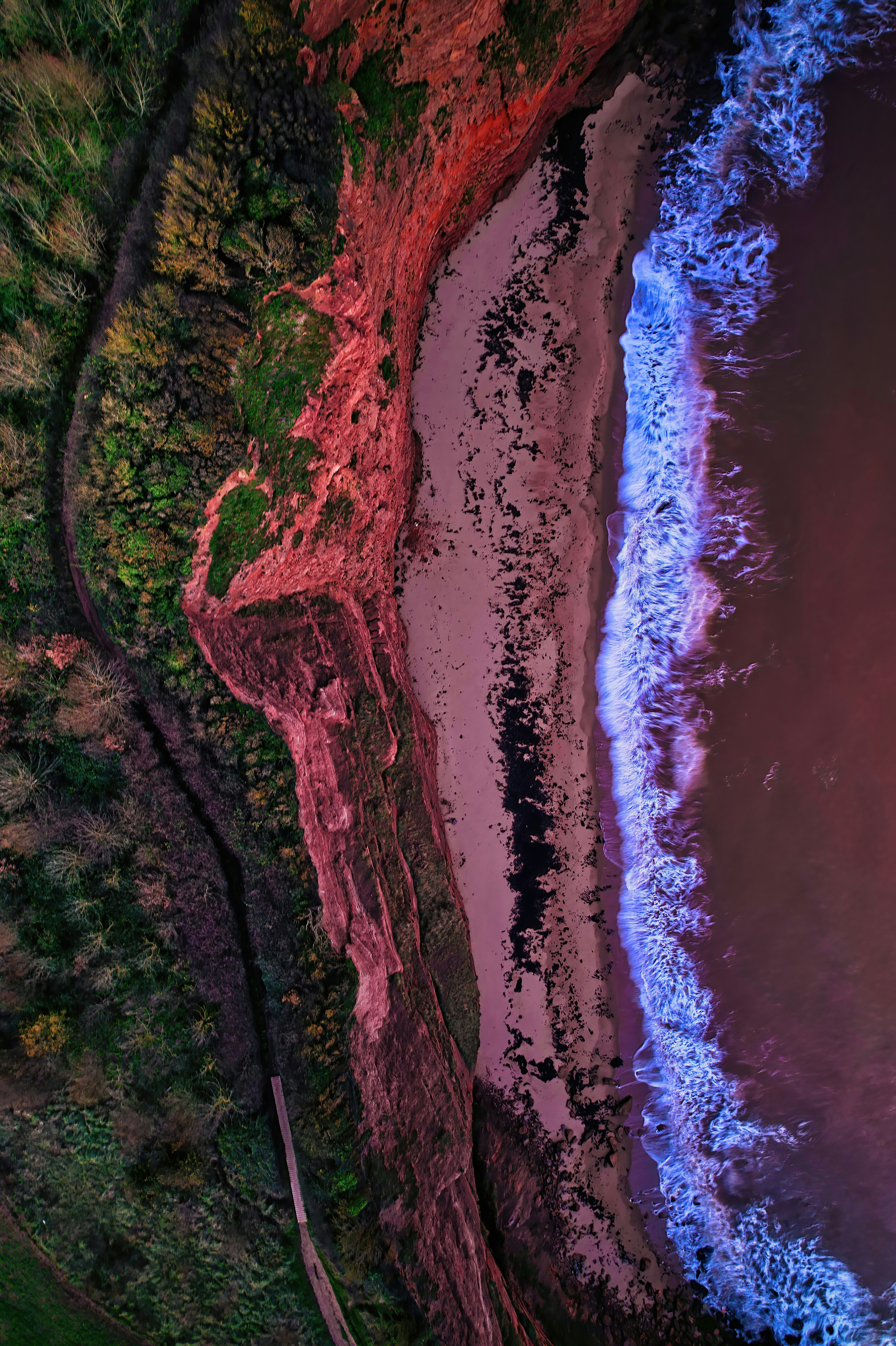 Crimson Cliffs, Velvet Beach, and Electric Tide: An Aerial Coastline in Neon Hues