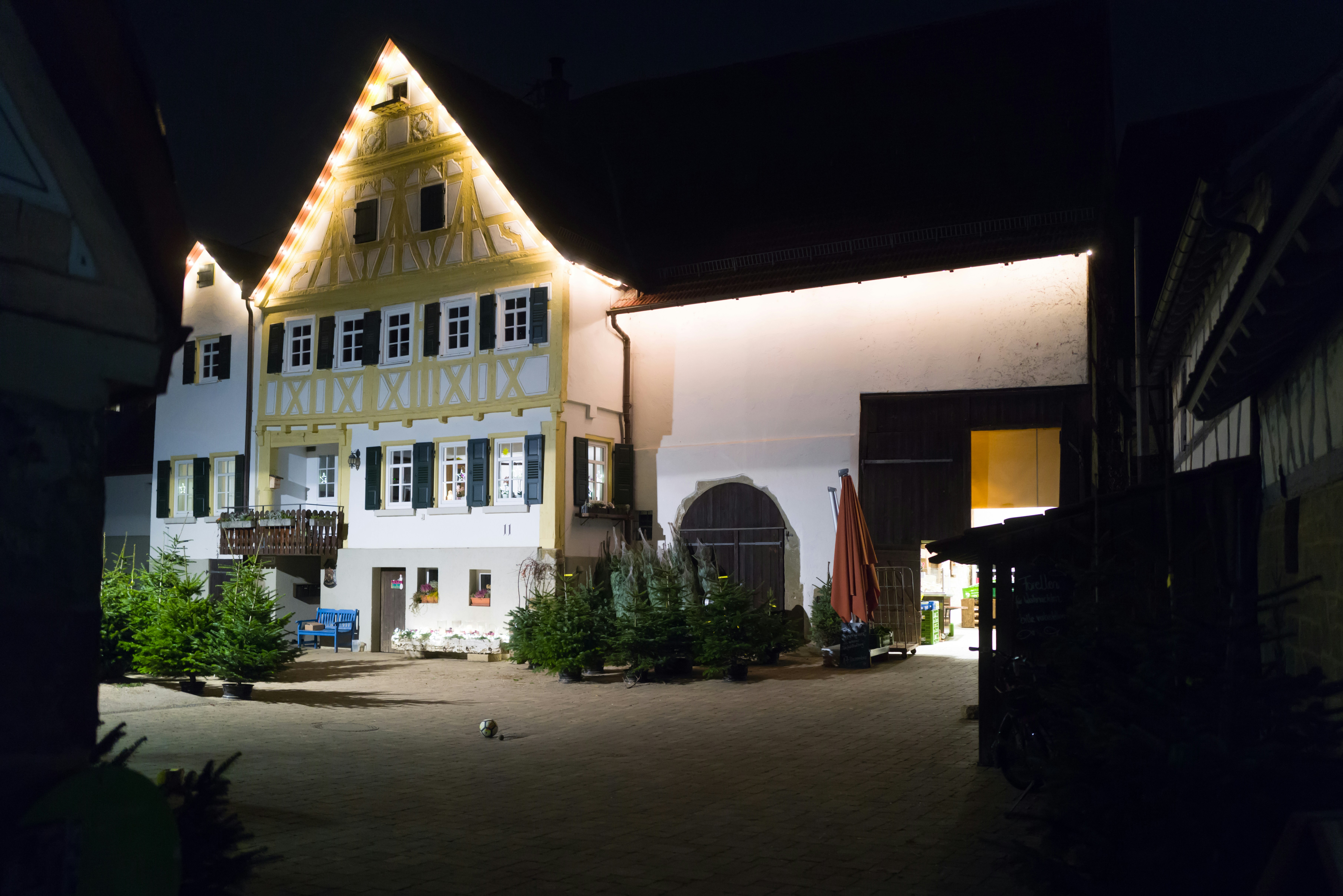 Timber-Framed Nightscape: Warm Courtyard Lights on a Bavarian Inn