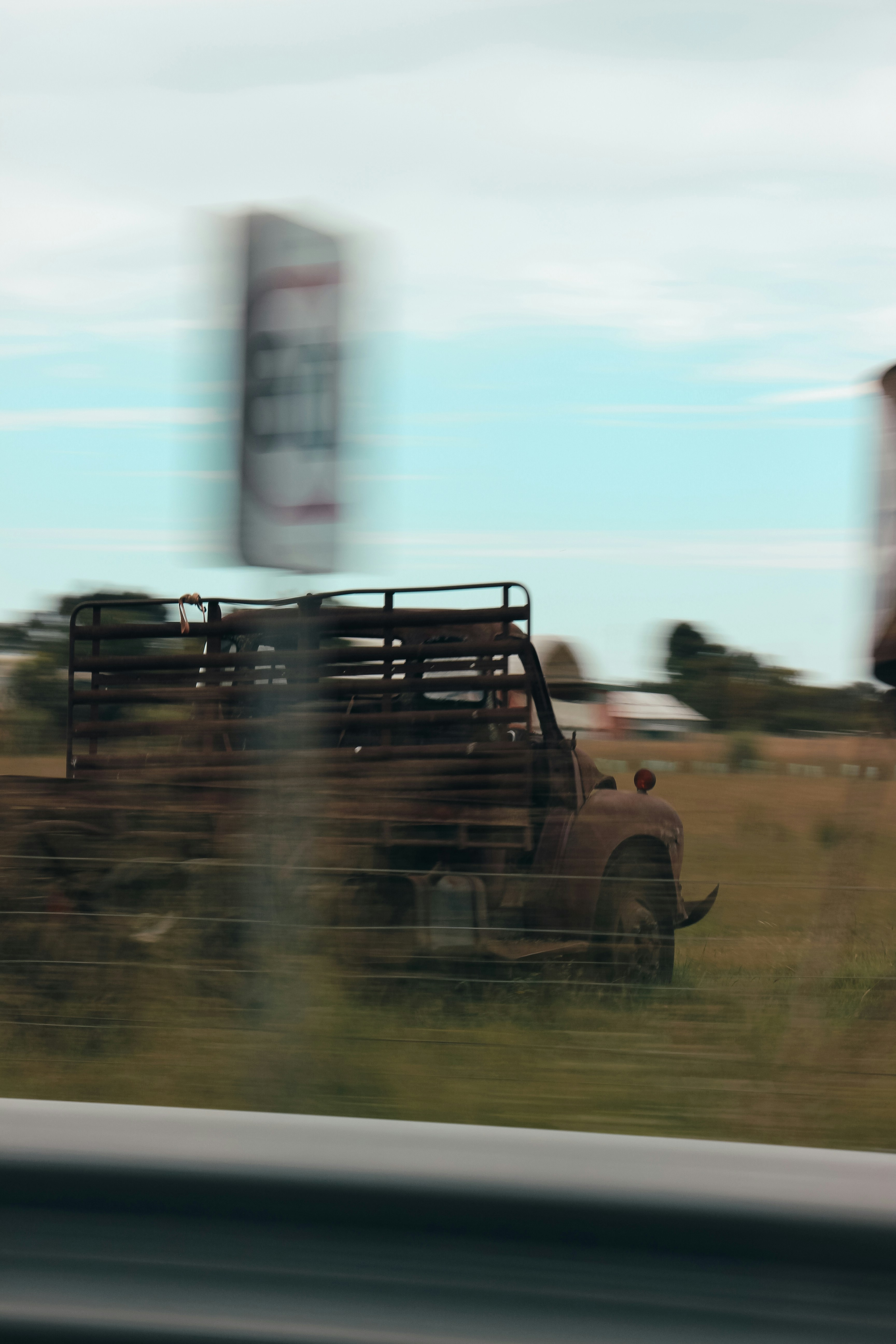 Rusted Pickup on a Blurred Backroad
