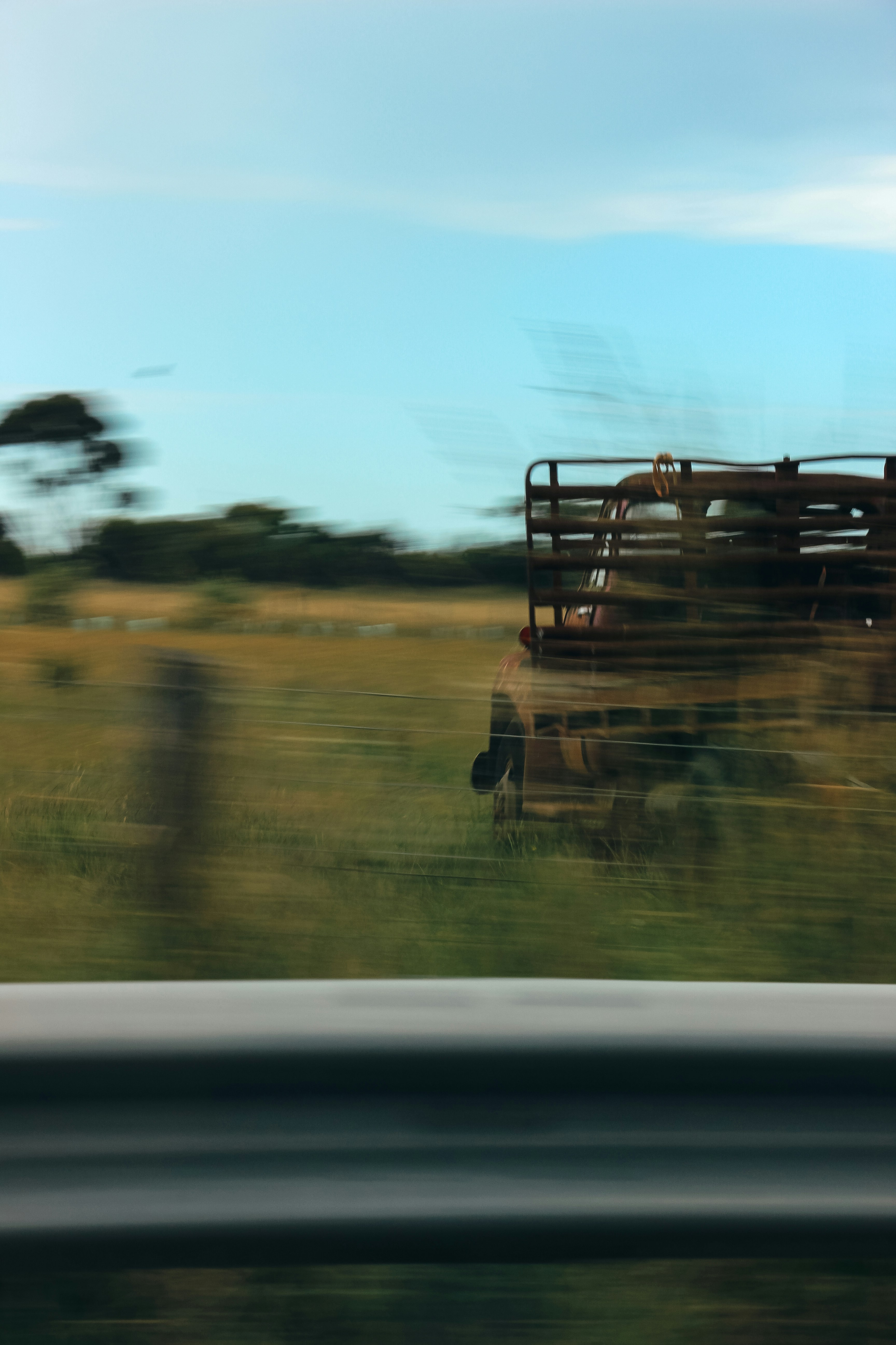 Prairie in Motion: A Farm Trailer Traversing the Blur