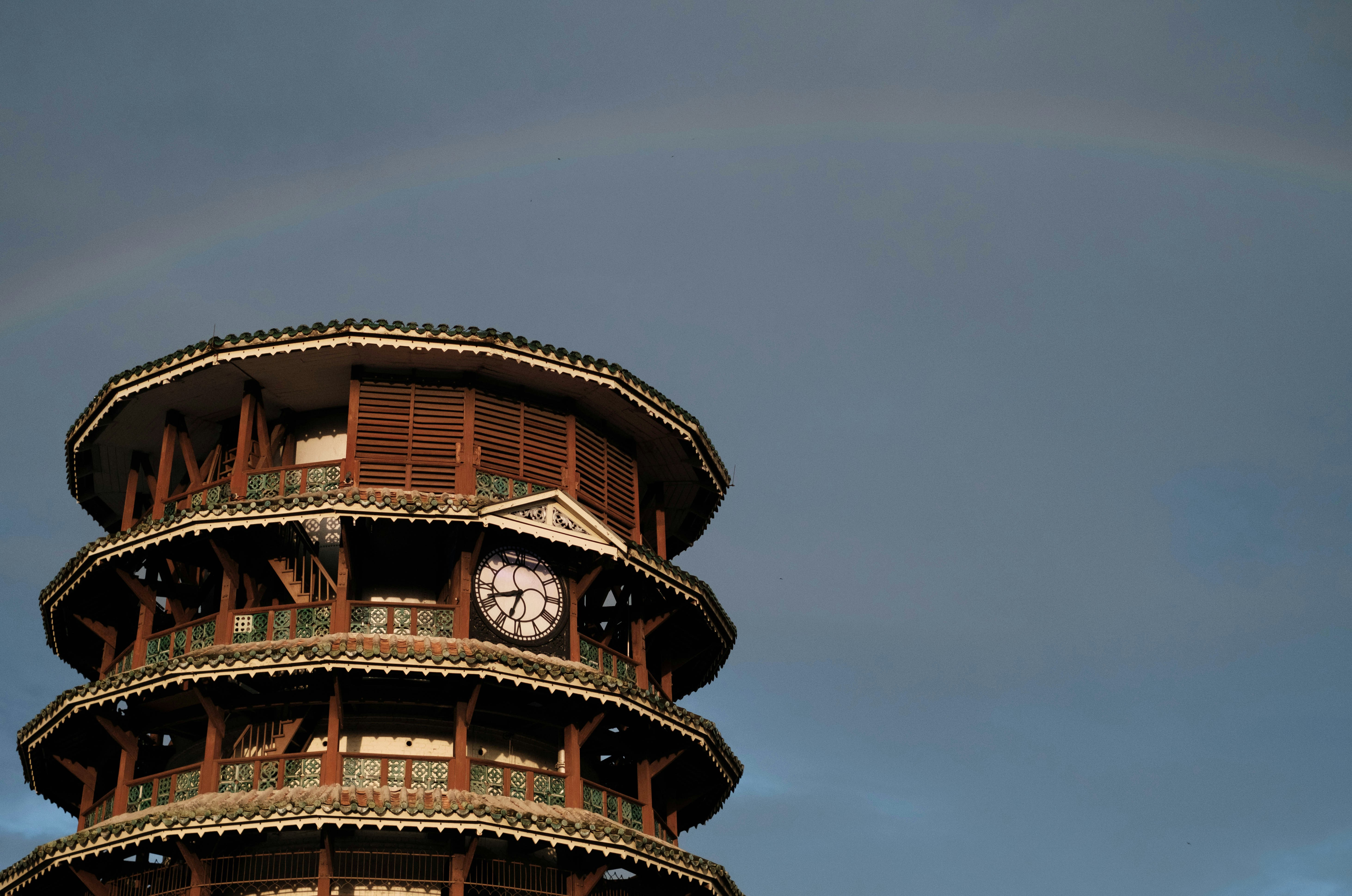 Clock on the Circular Pagoda: Time Echoes Through Timber Rings