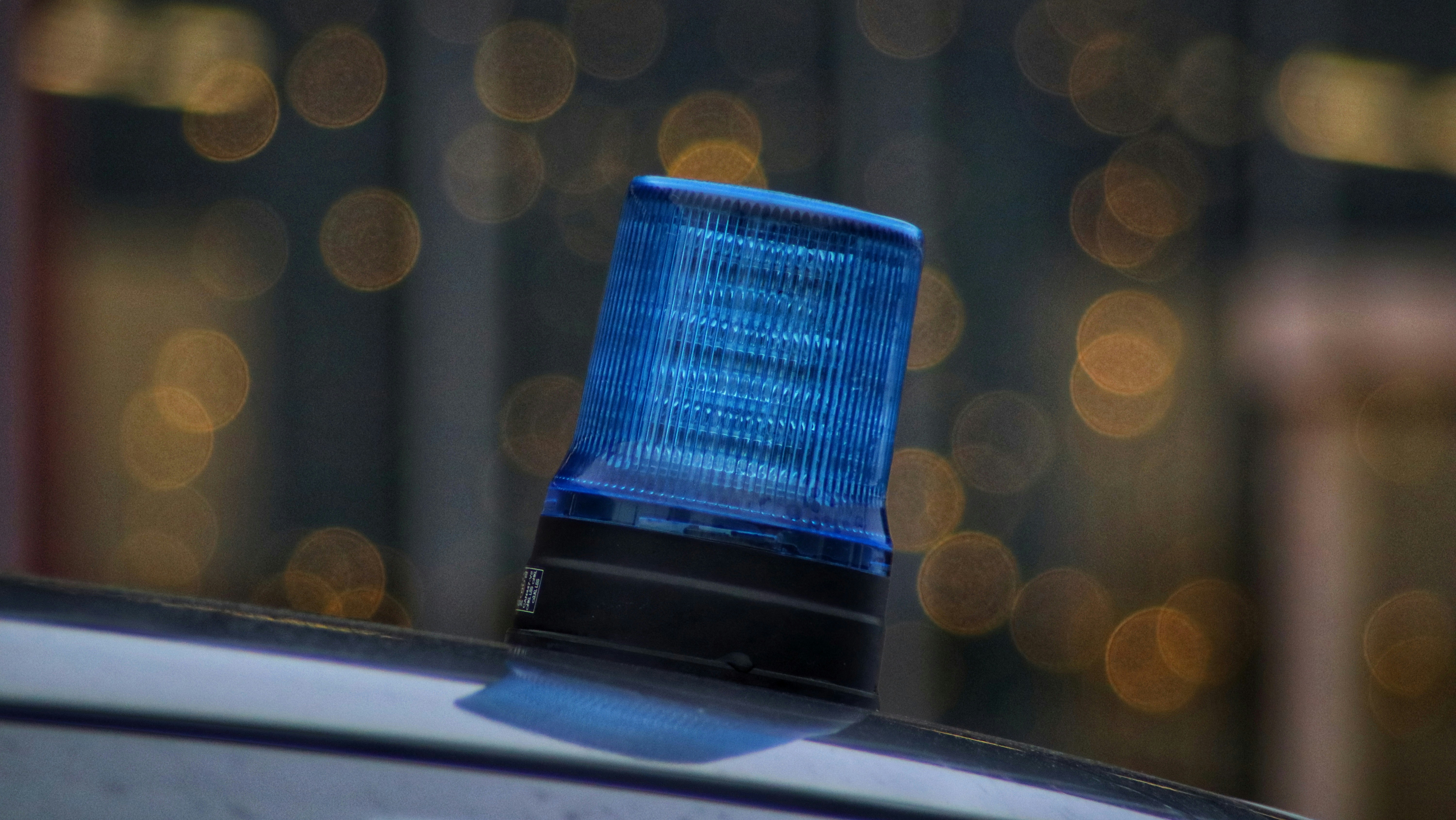 A close up of a blue light on top of a car photo – Free Blue Image on ...