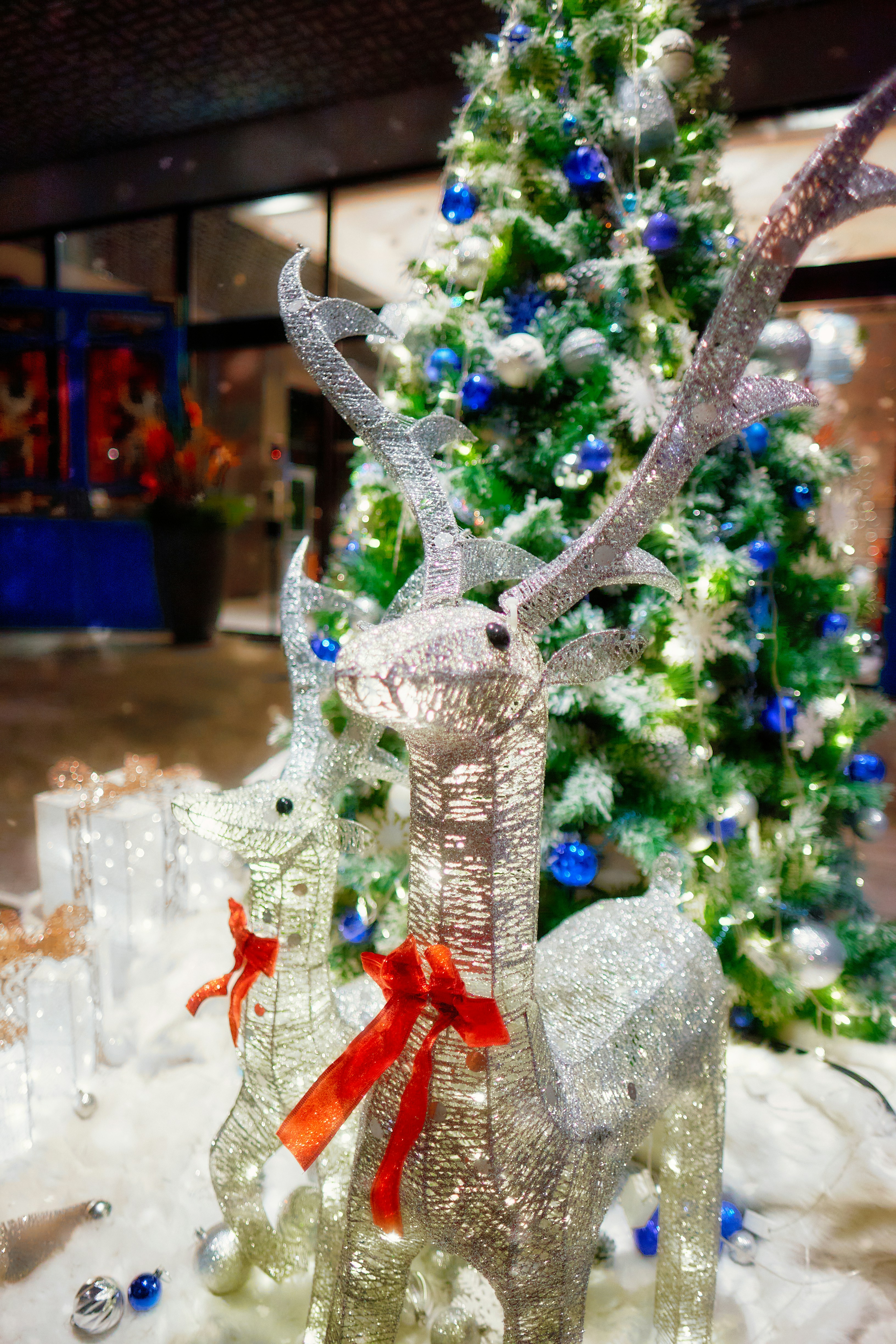 Glittering Reindeer Spotlight beneath a Christmas Tree