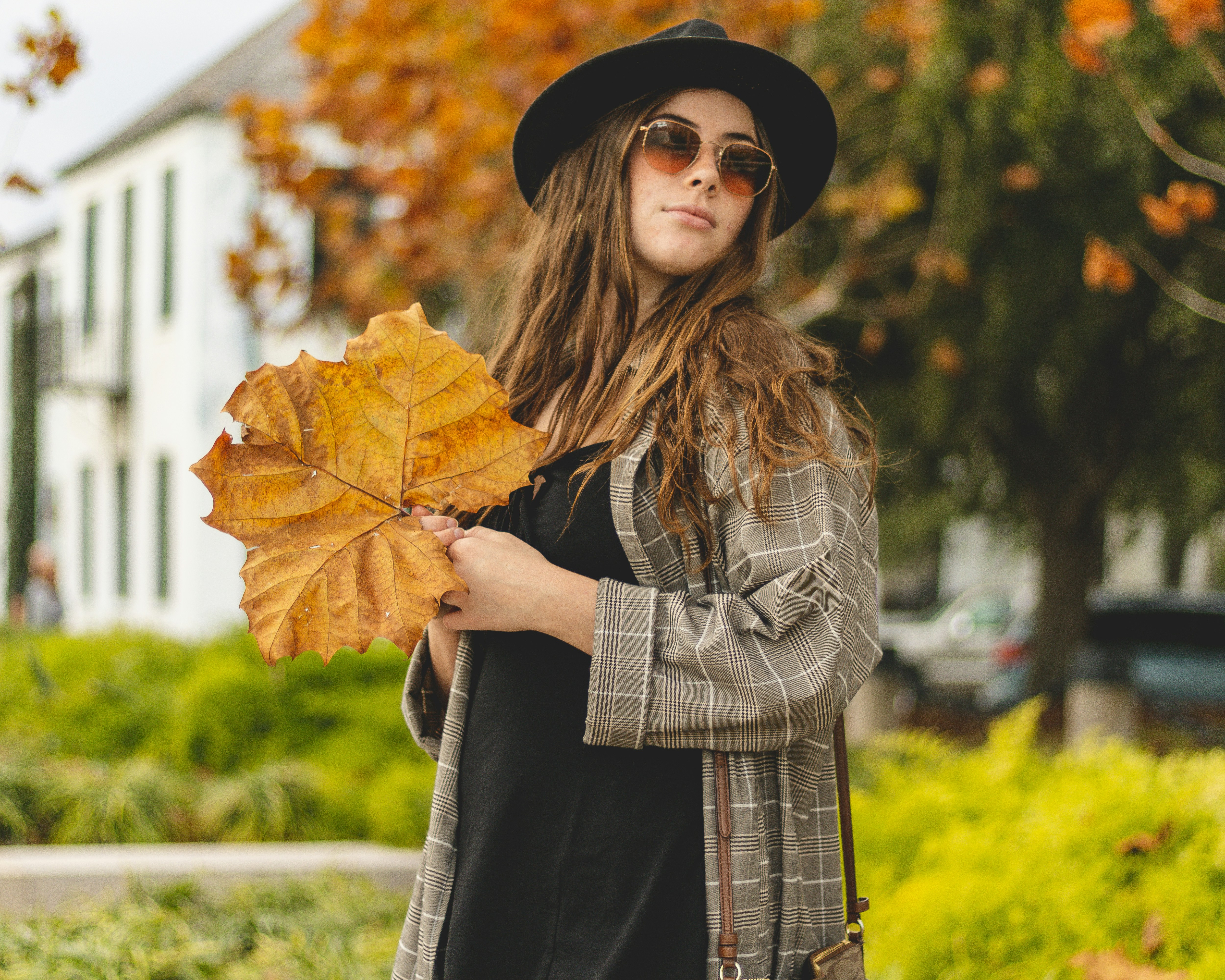 Autumn Portrait: Leaf Keeper in Plaid and Sunglasses