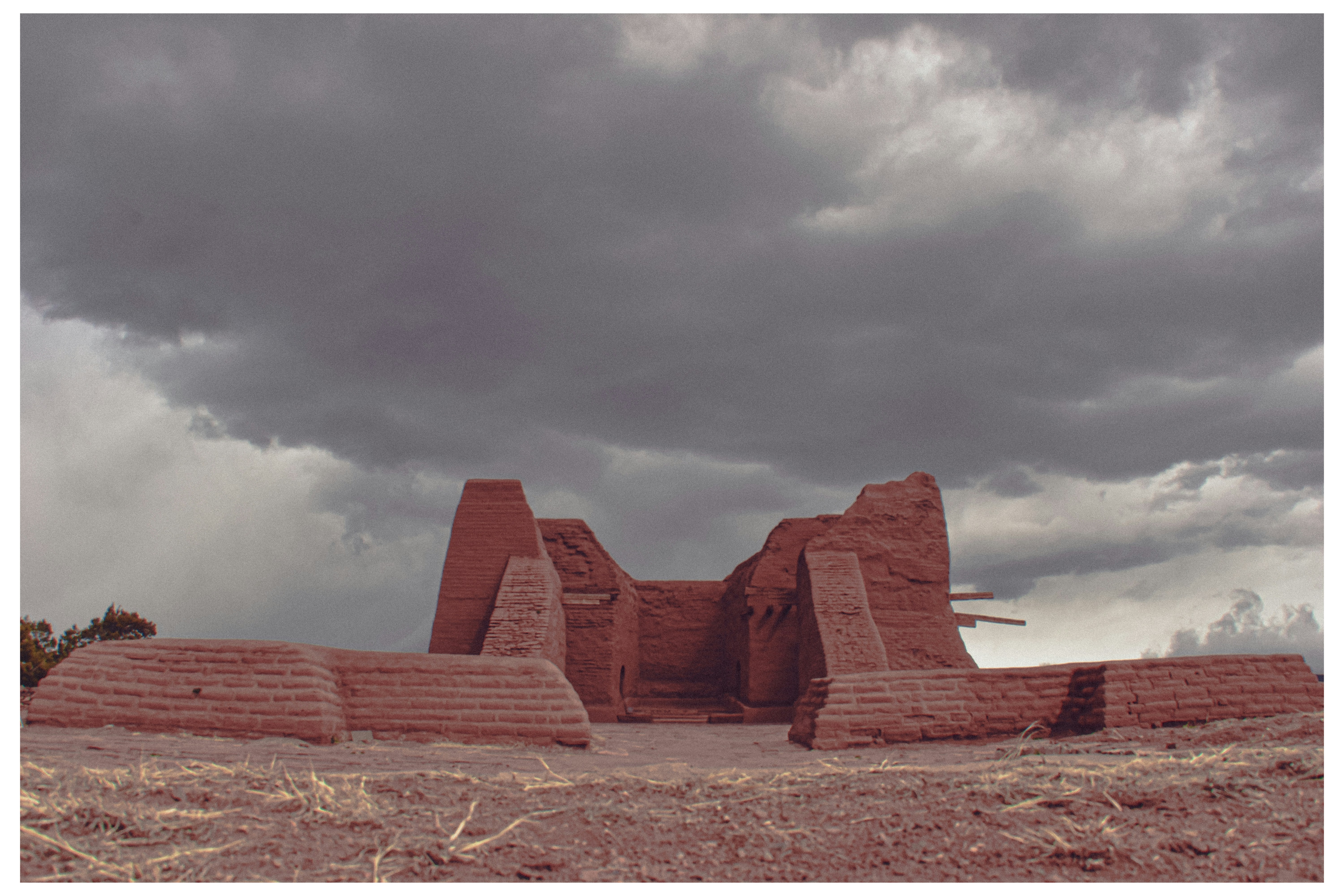 Adobe Citadel Beneath a Looming Sky over a Parched Plain