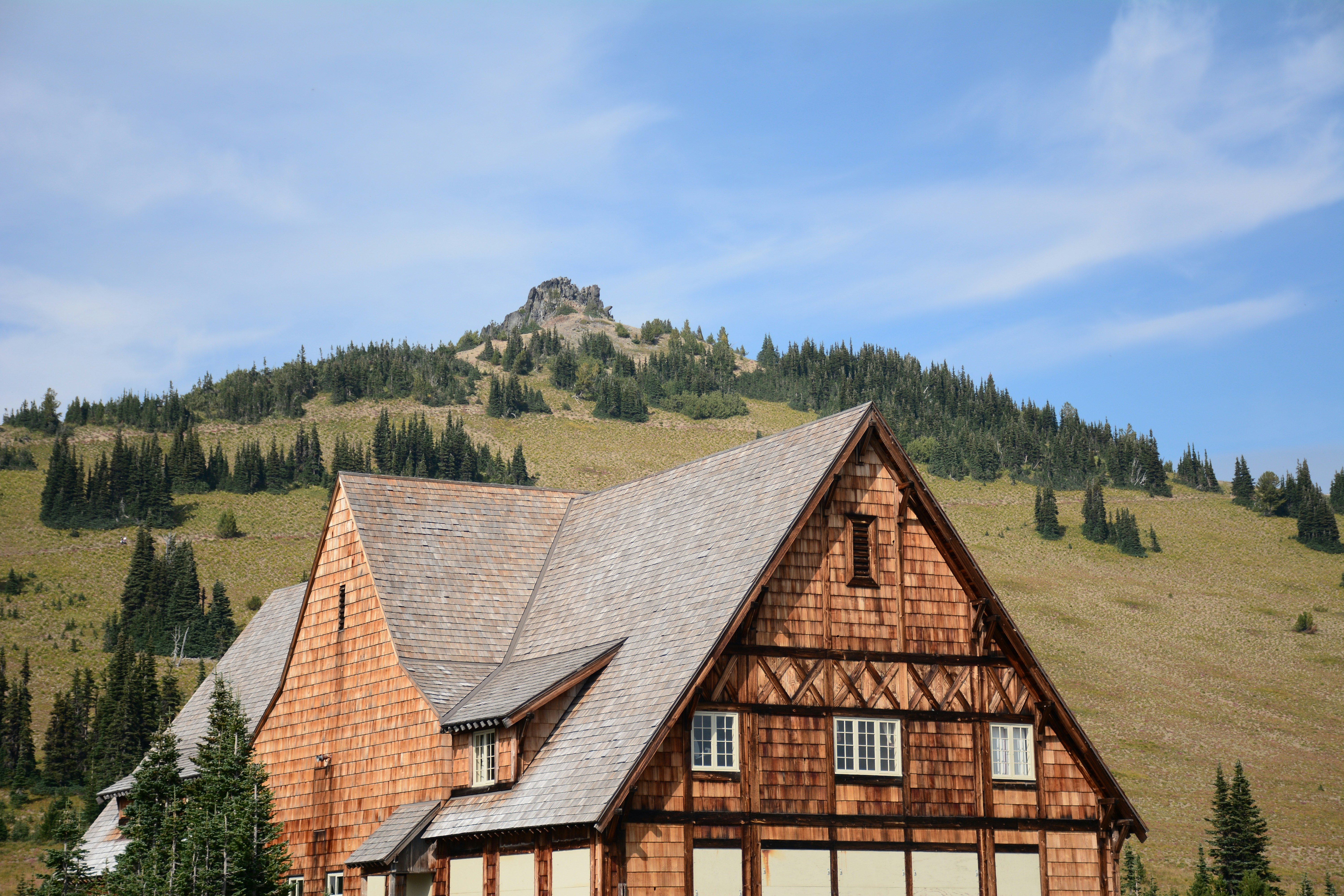 Rustic Chalet Nestled Beneath a Mountain Crest