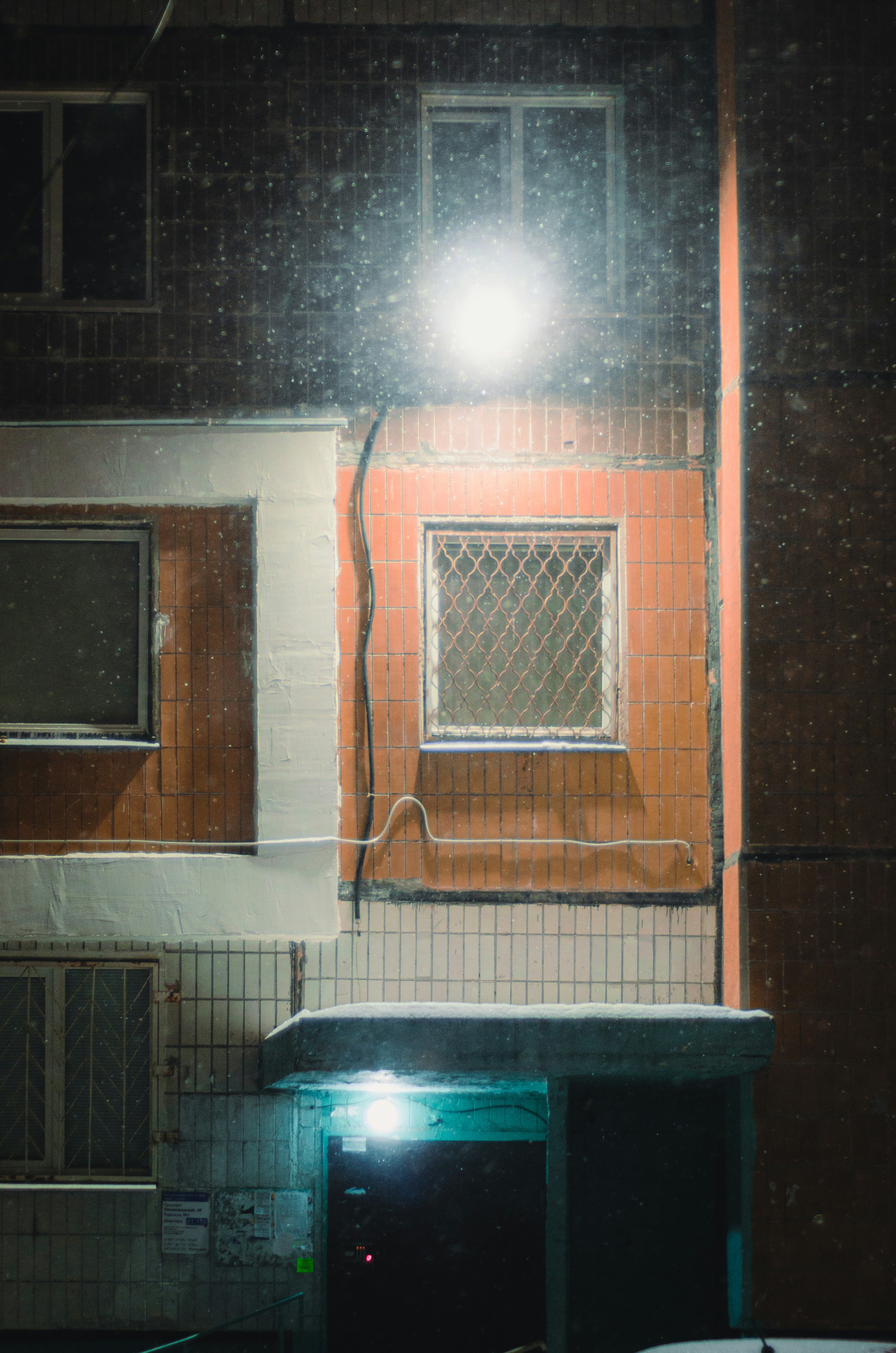 a building with a window and a light on it