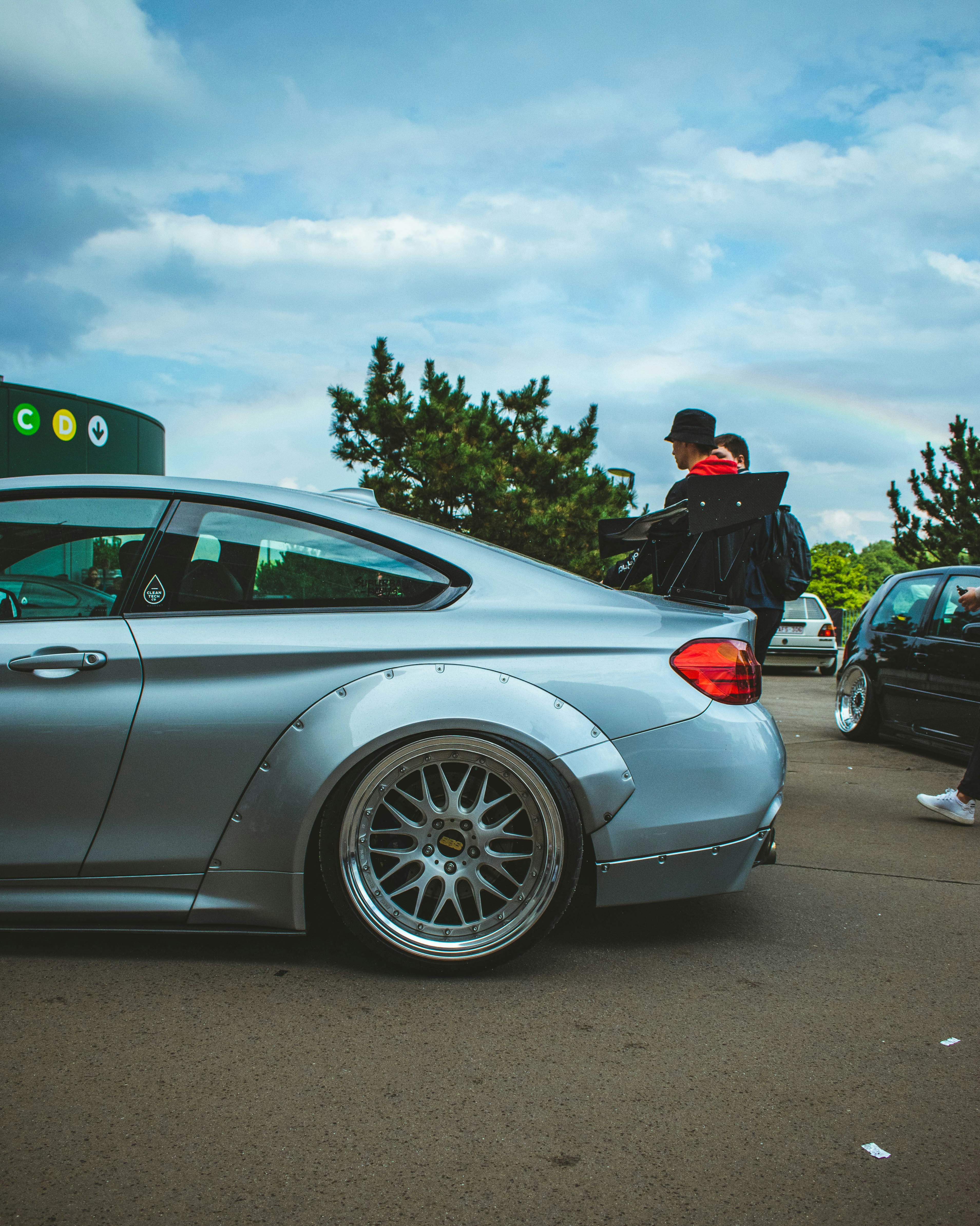 Low-rung Velvet: a silver coupe with widened stance at a car meet