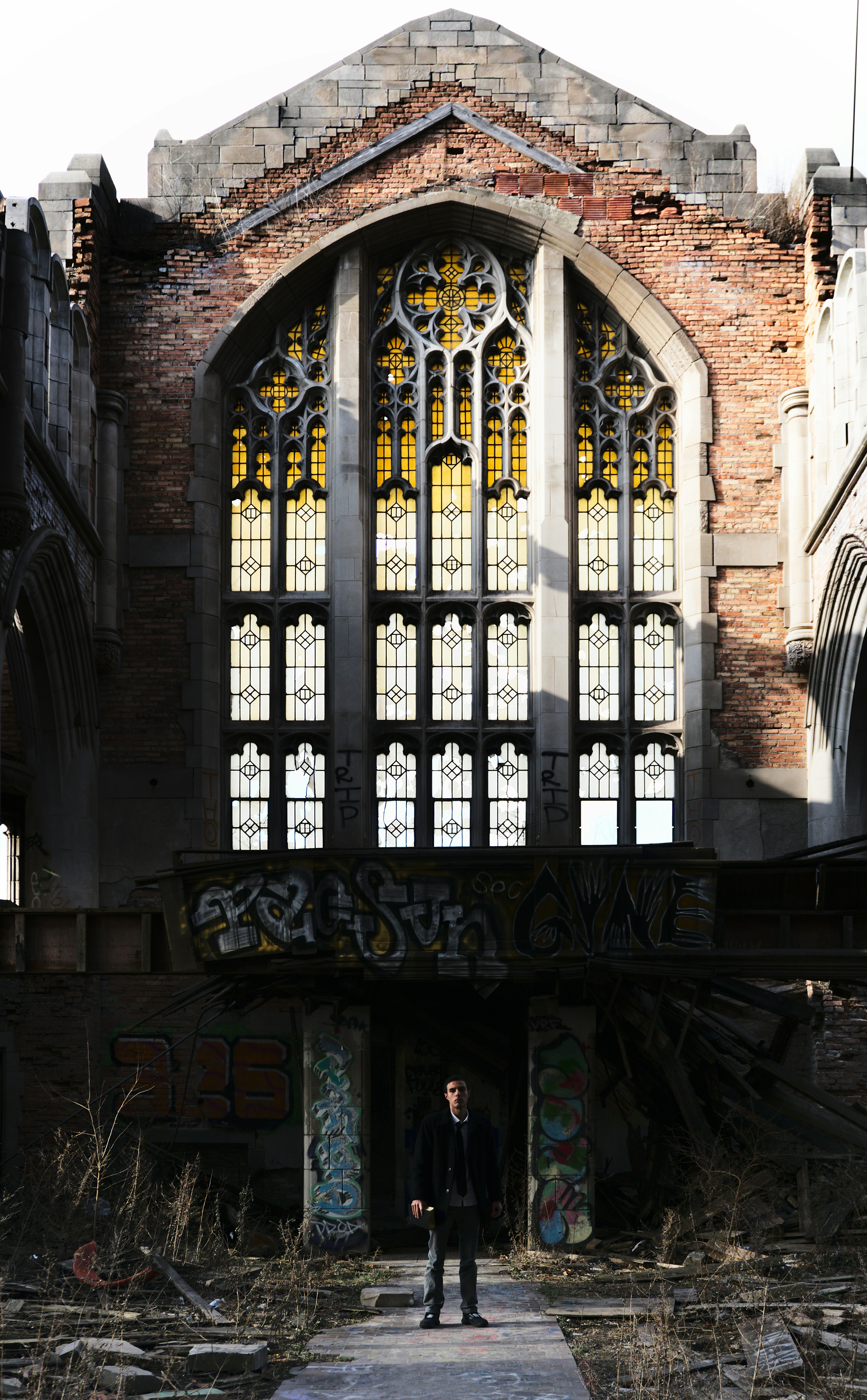 a man standing in front of a very old building