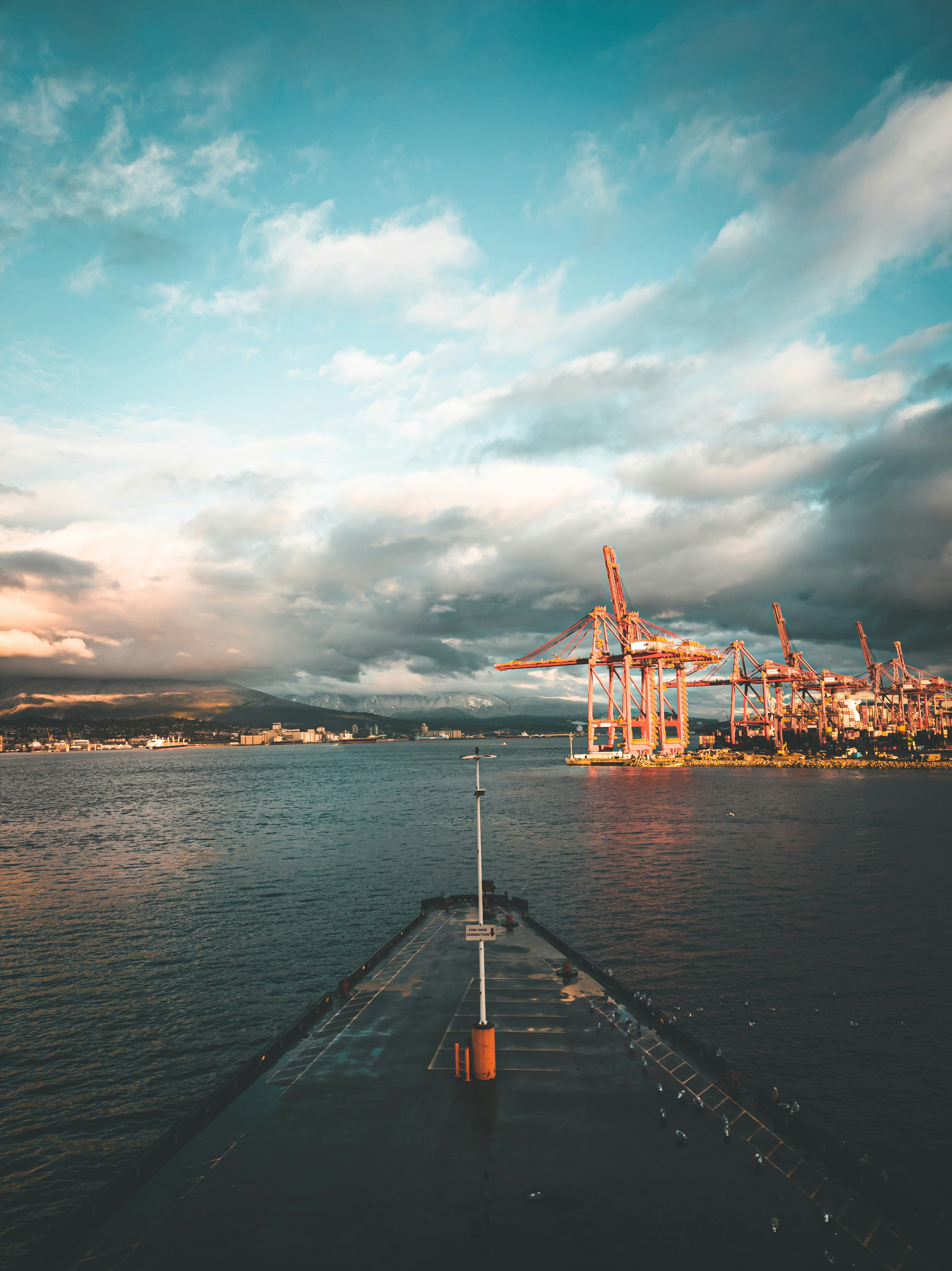 Toward the Port: A Pier Reaches into Calm Seas Under A Dramatic Sky