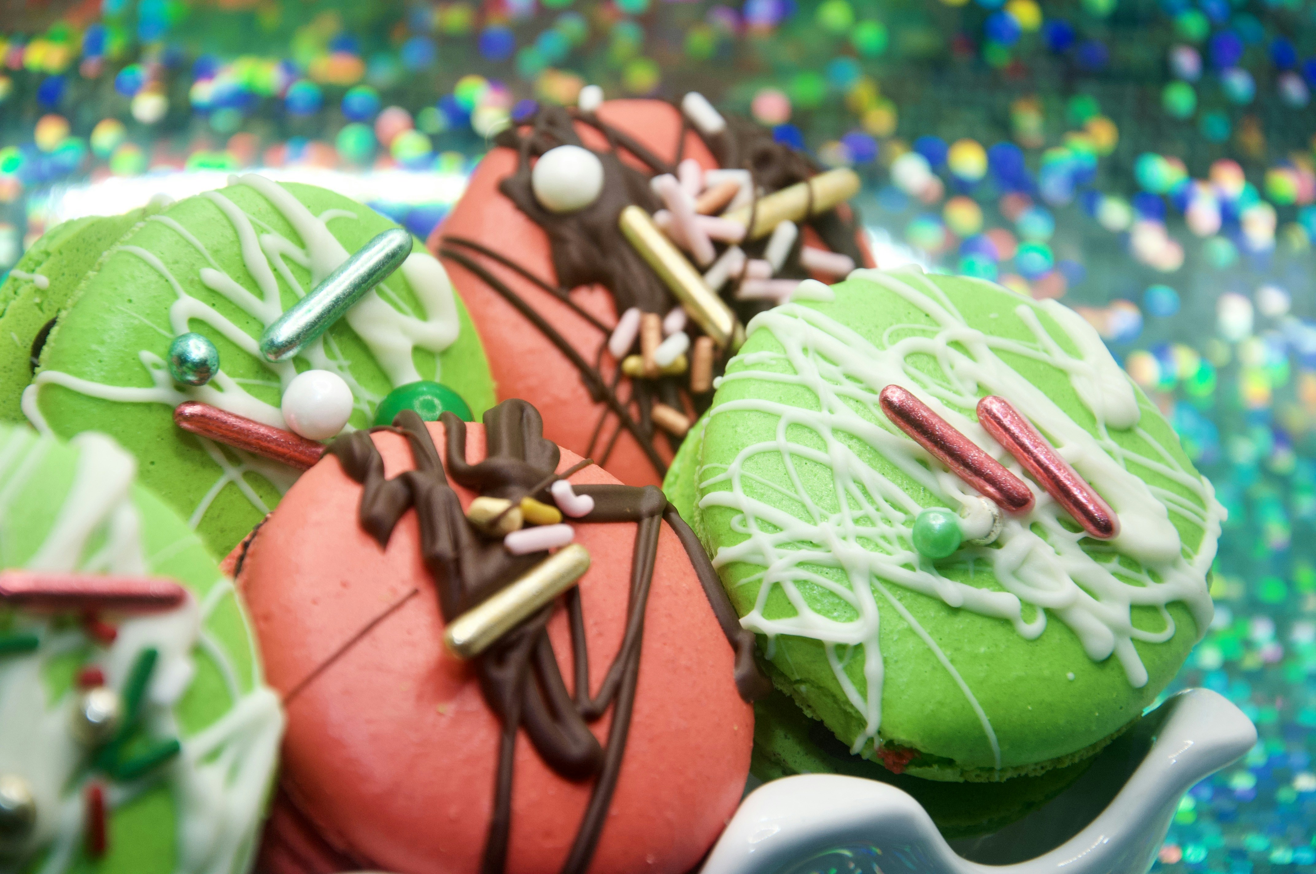 Candy-coated Macarons in a Rainbow Confetti Spotlight