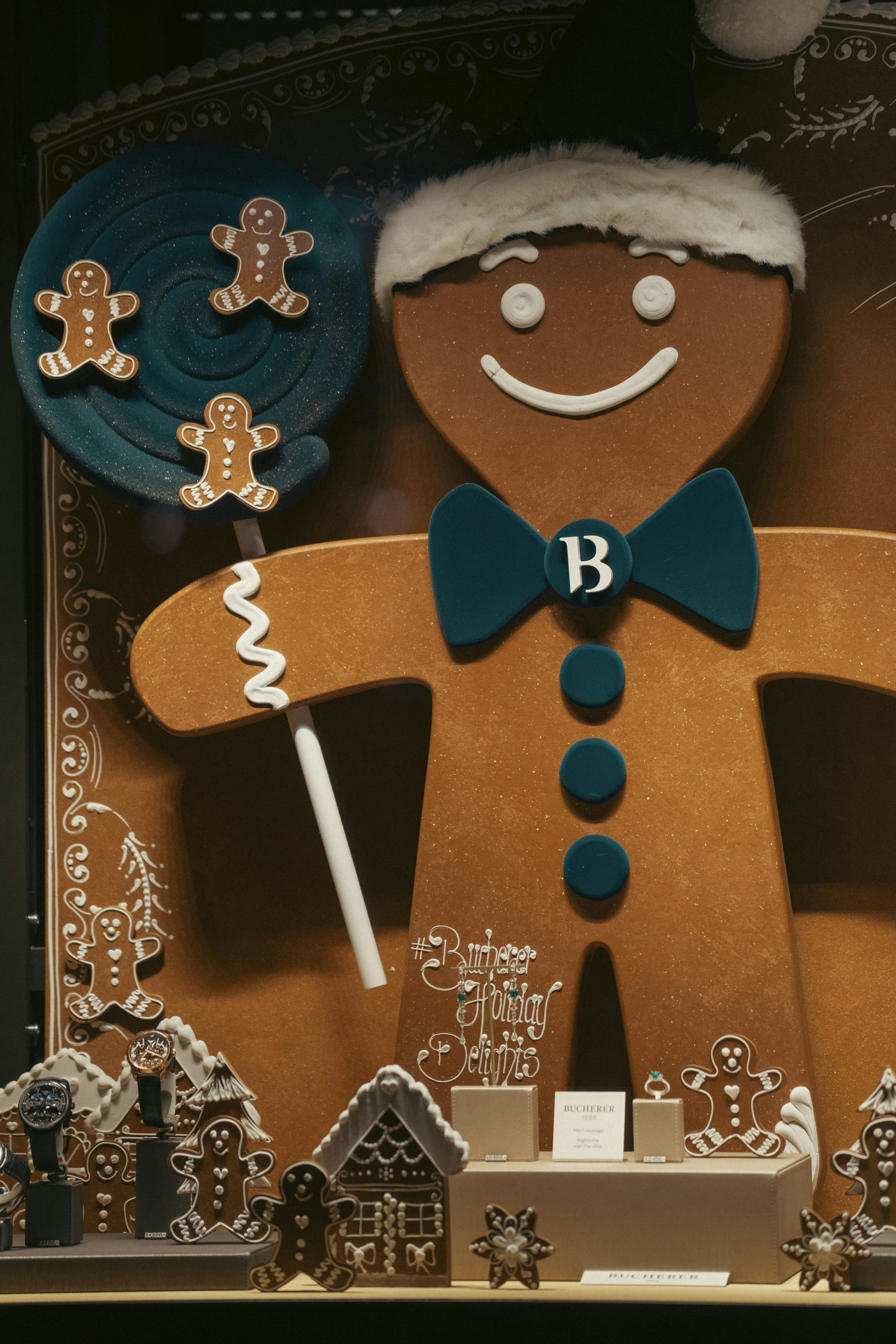 a gingerbread man with a blue bow tie