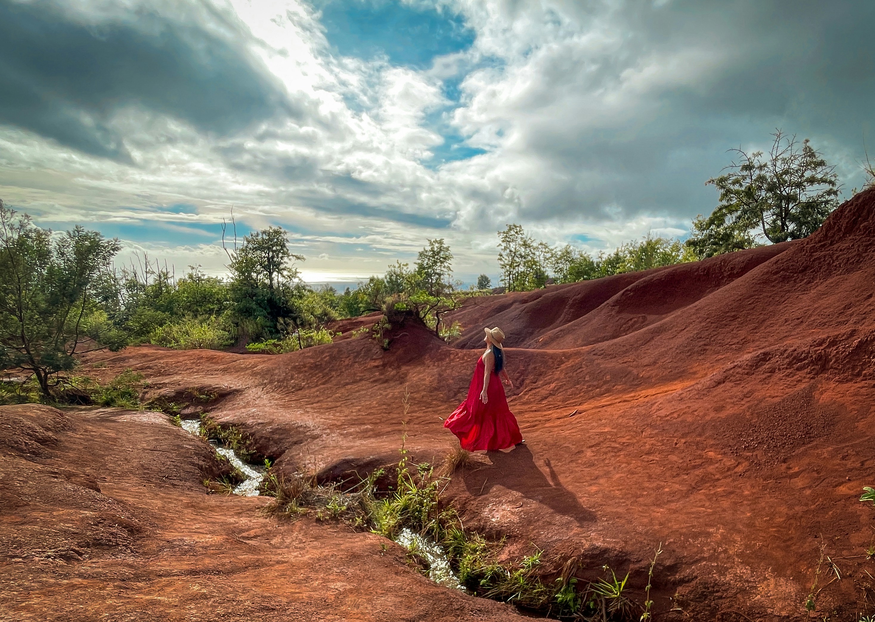 Red Dunes, One Figure: A Lone Dancer Traverses Wind-Sculpted Badlands
