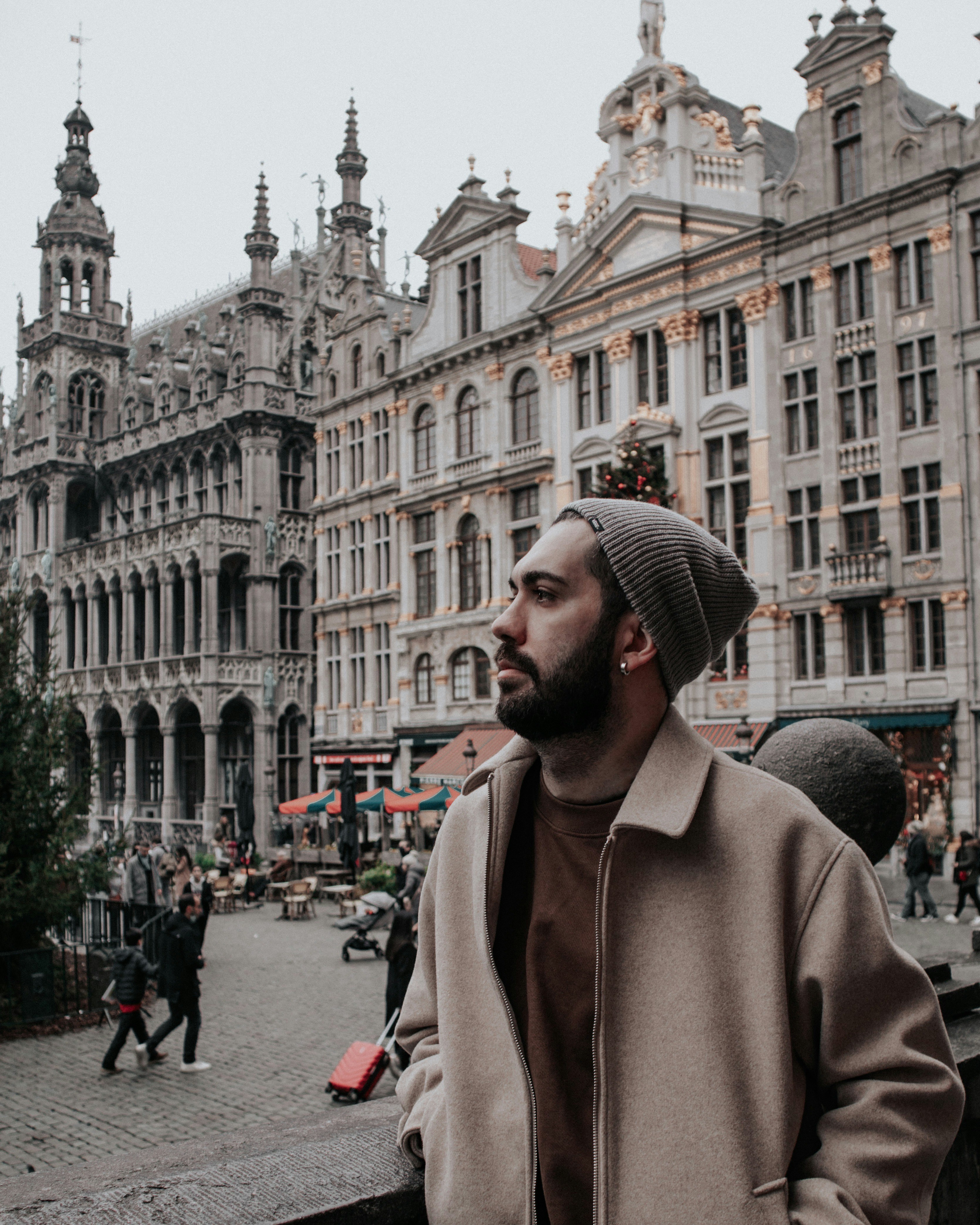 Bearded Moment in Brussels' Grand Place: Portrait Amid Ornate Facades