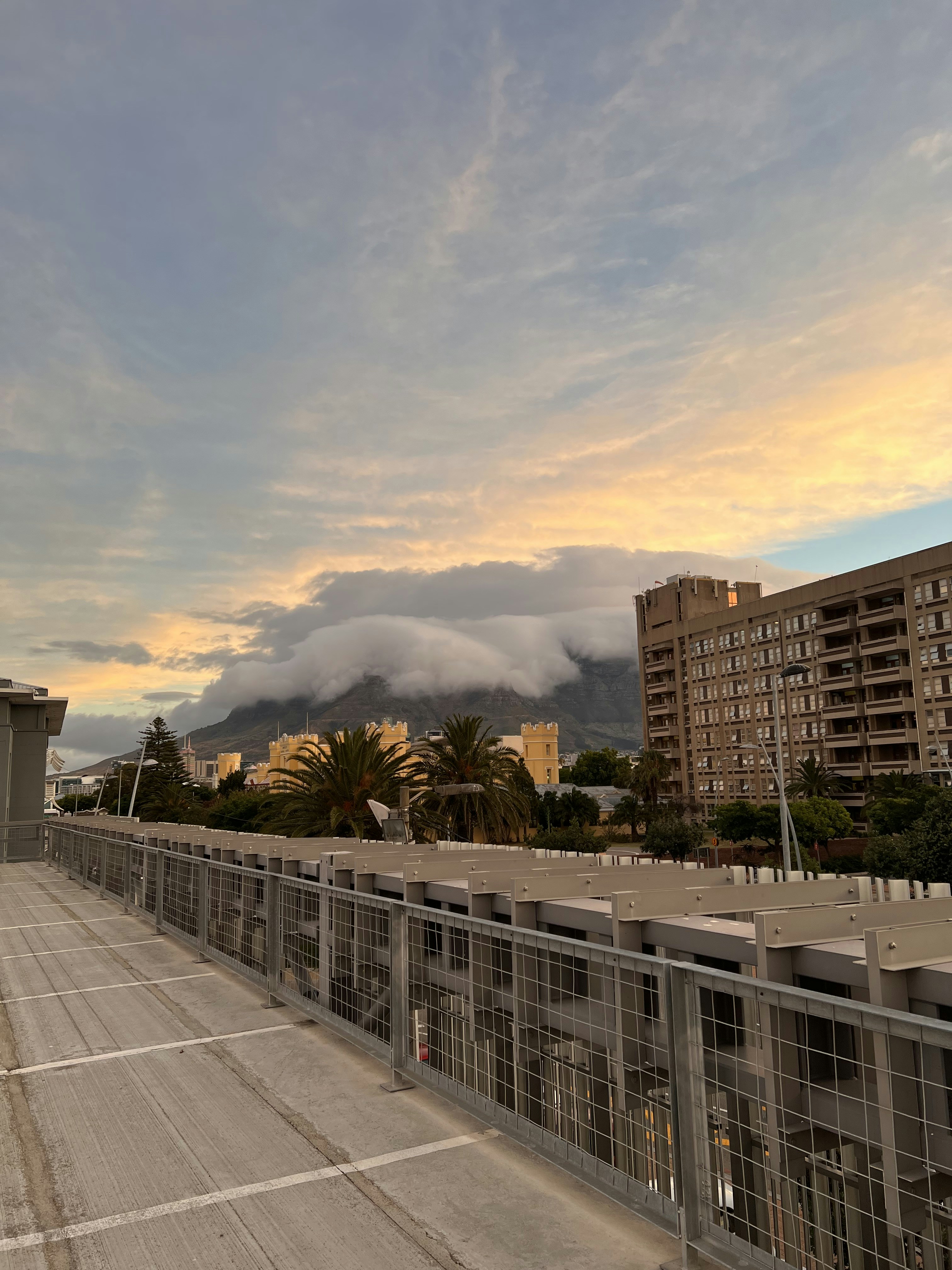 a view of a city with mountains in the background