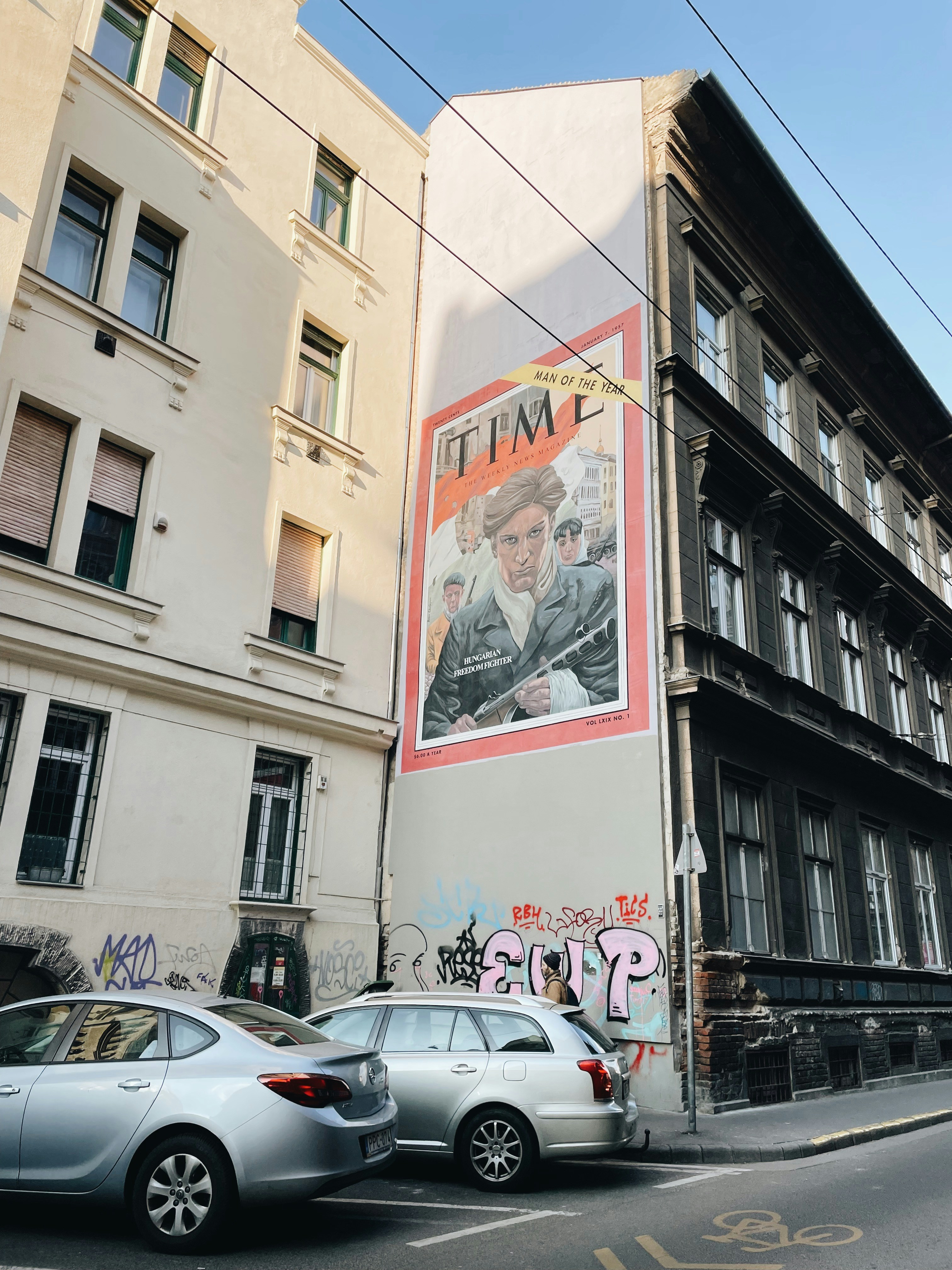 A large poster on the side of a building photo – Free Street ...