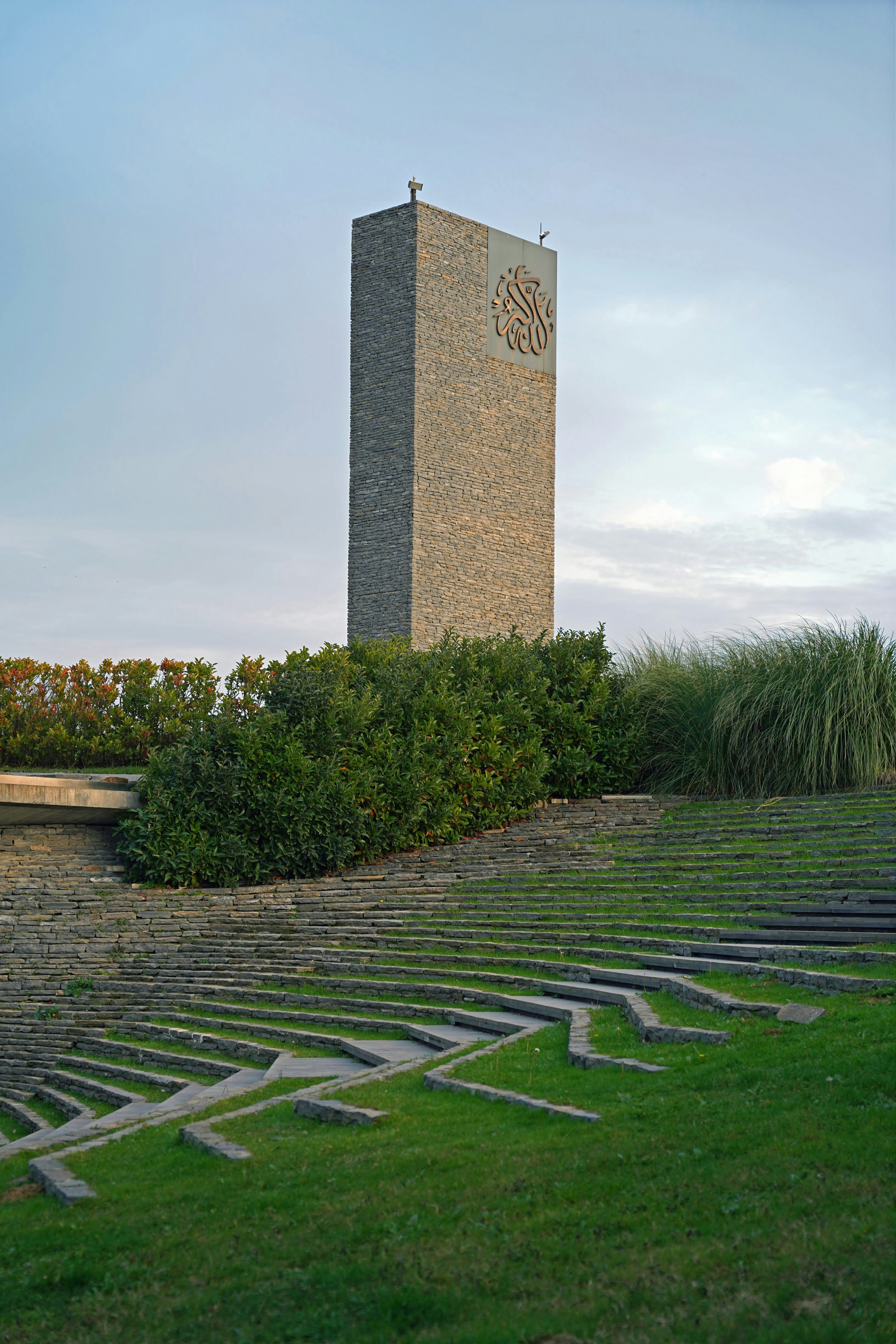 Emblem Obelisk Rising Over a Quiet Terraced Lawn