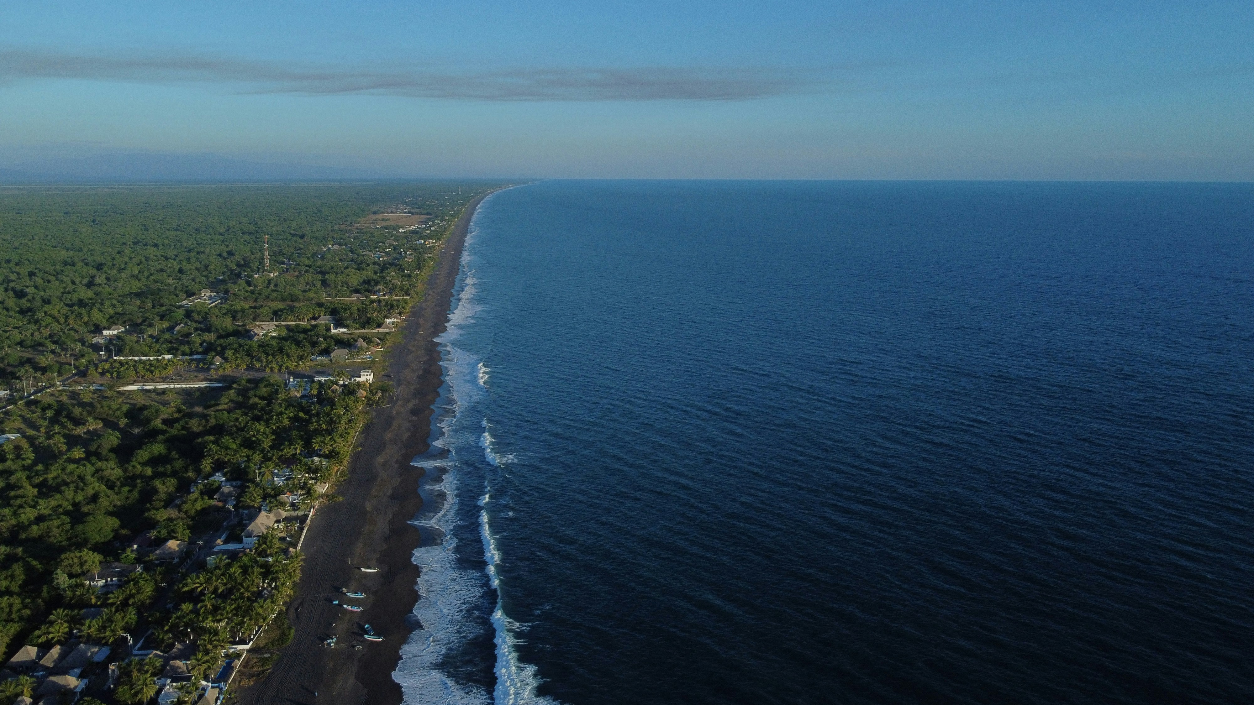 an aerial view of a beach and ocean