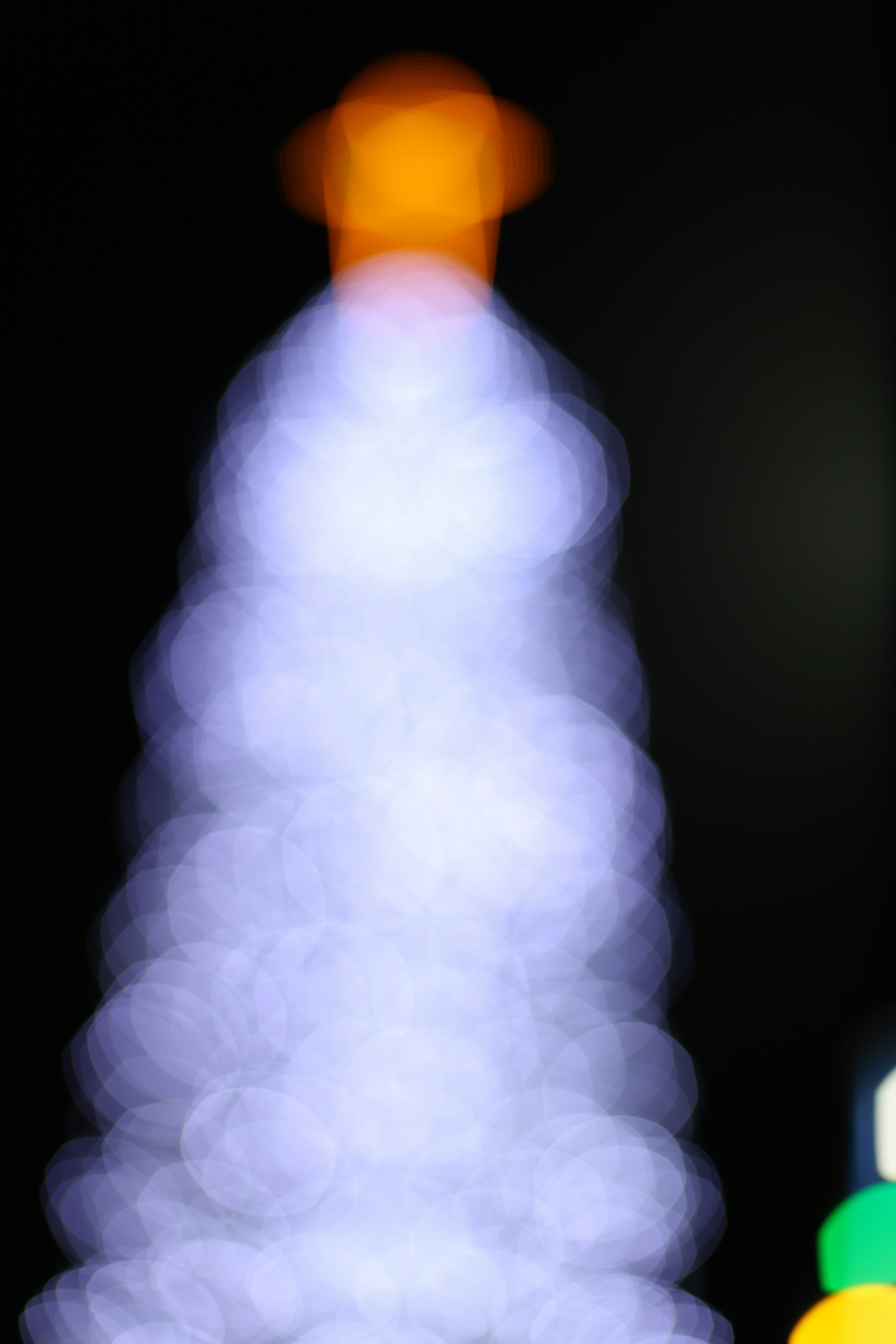 Orange Beacon on a Frosted Tower: Evening Lights in Bokeh