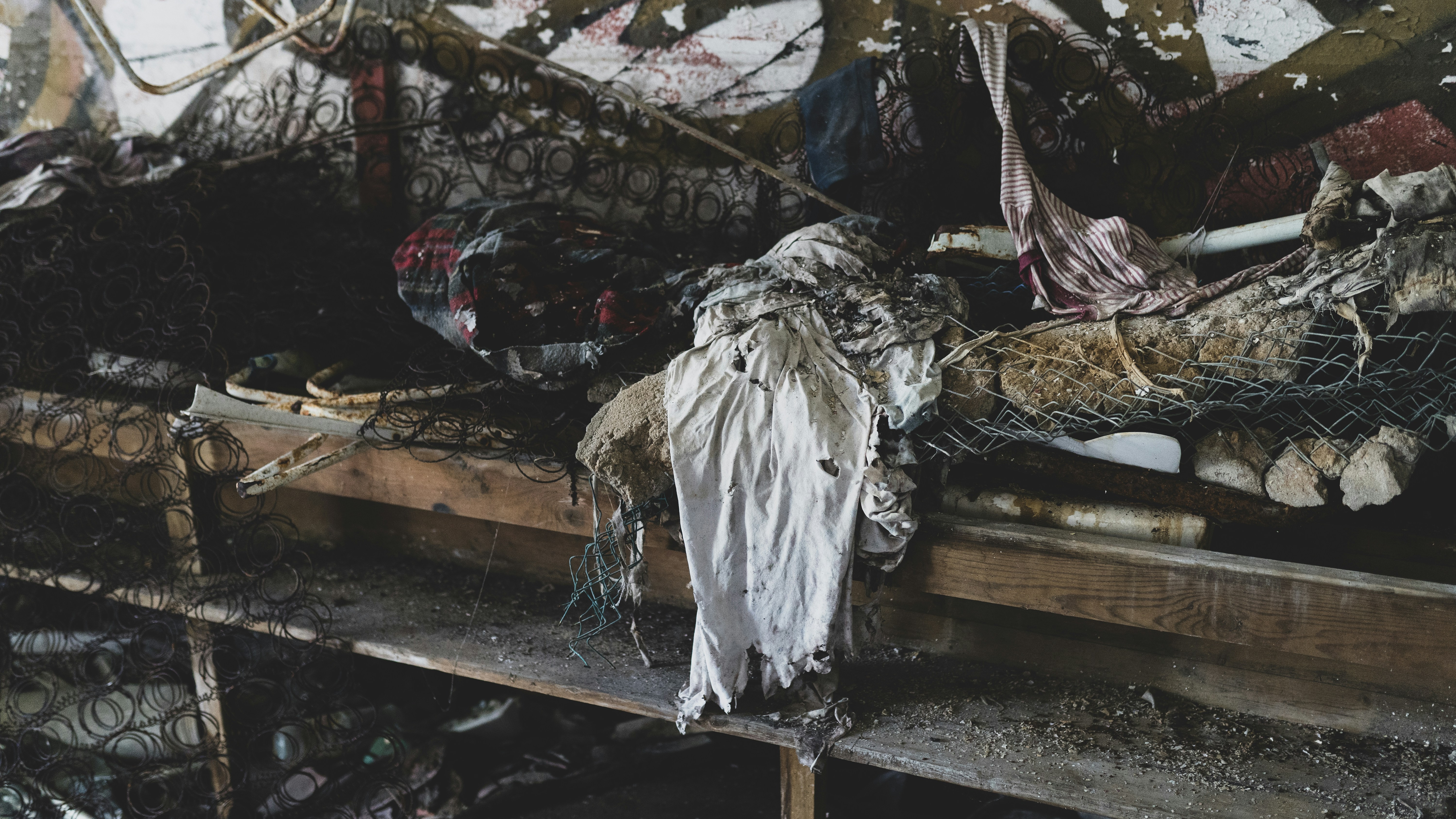 White Cloth Amid Decay: A Quiet Corner in a Derelict Shelter